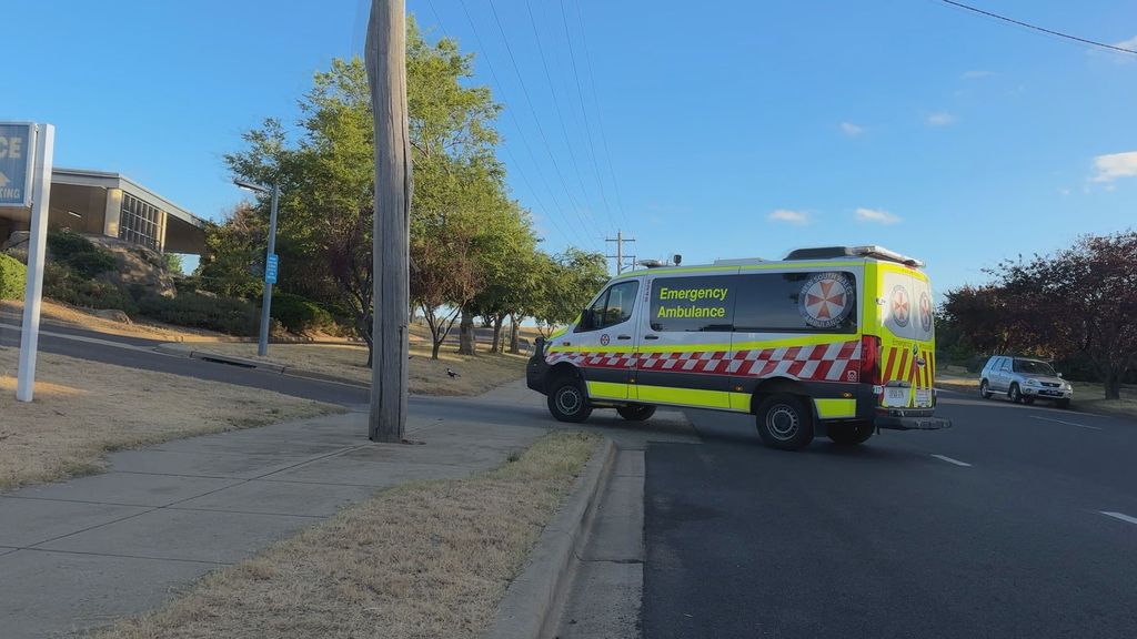 Hadi Nazari arrives at the Cooma hospital with his face covered. - ABC News