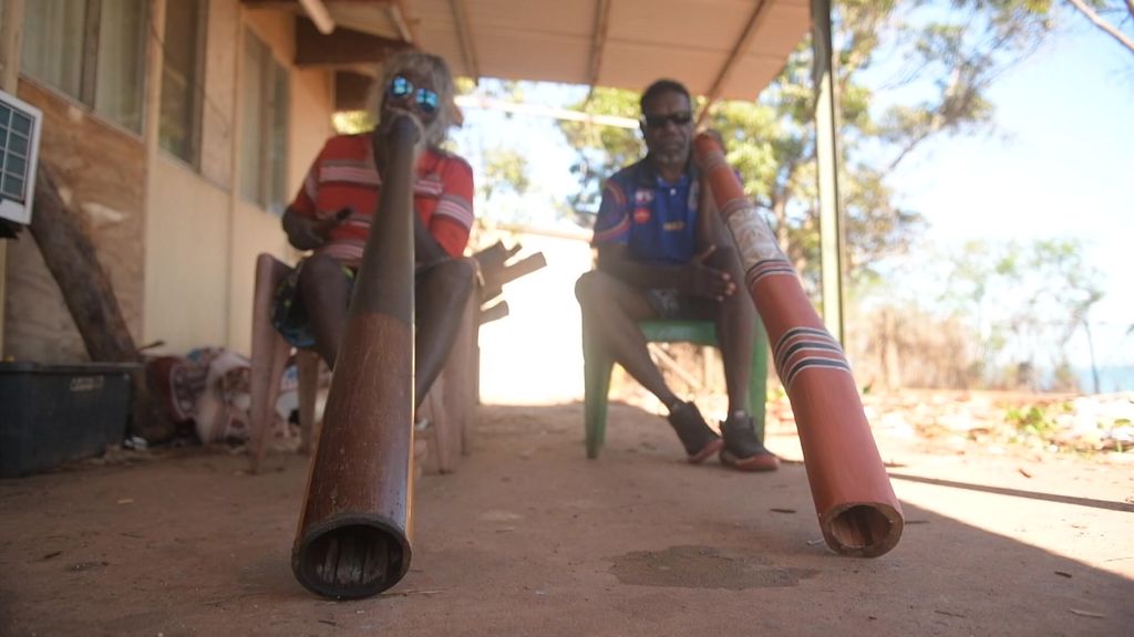 Mr Gurruwiwi playing the yidaki in Arnhem Land - ABC News
