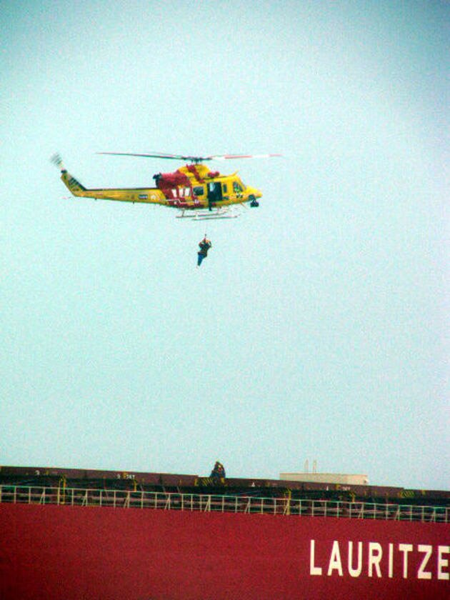 Freighter crew members winched to safety - ABC News