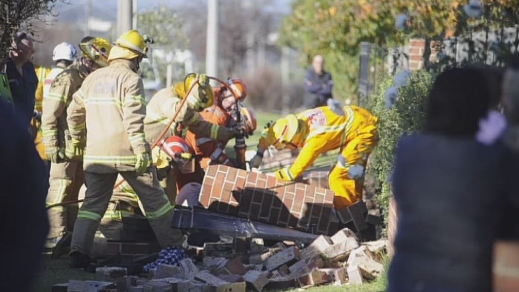 Emergency services work at scene of wall collapse that killed ...