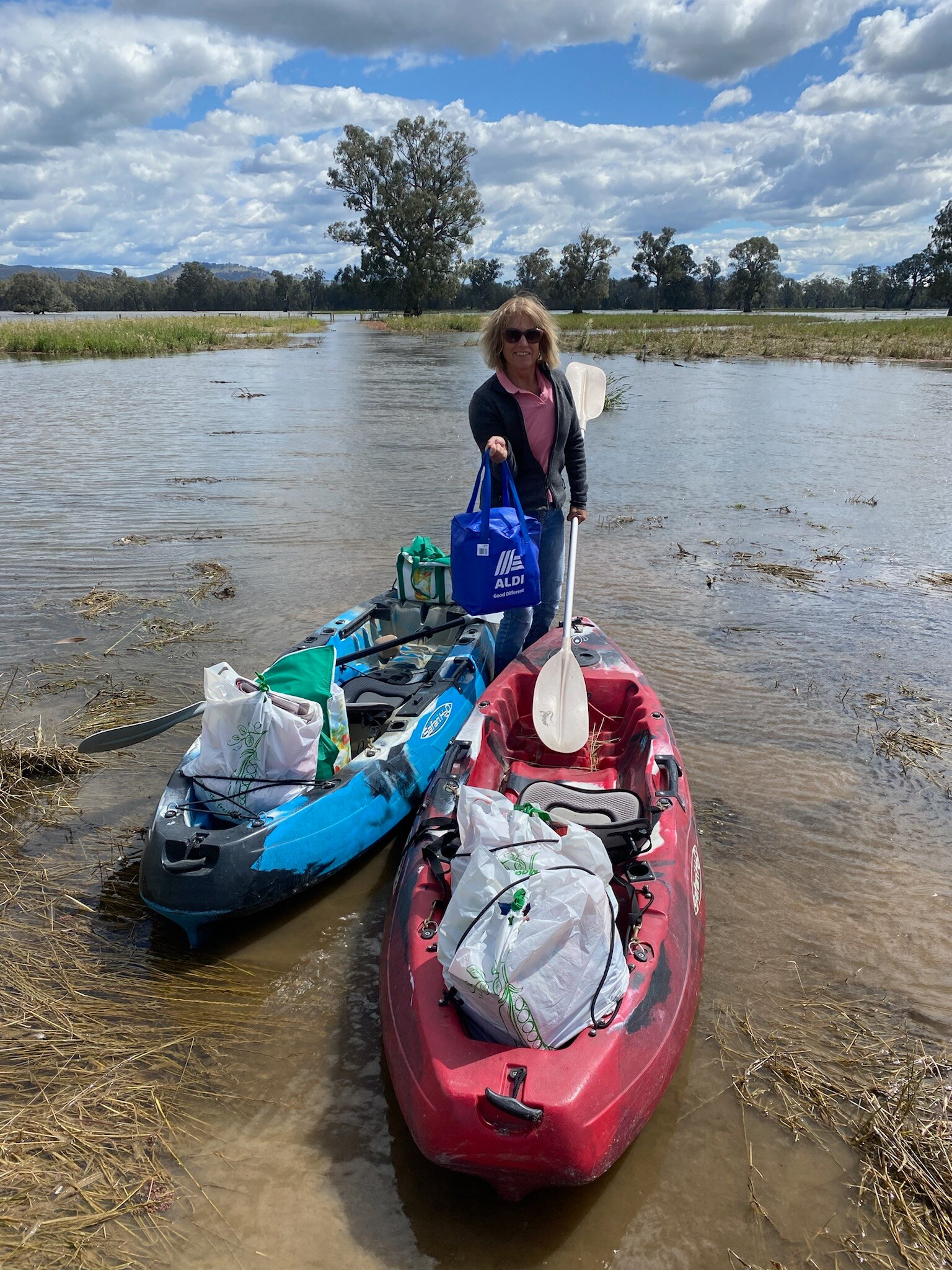 Farmers swap tractors for boats to access properties along flooded ...