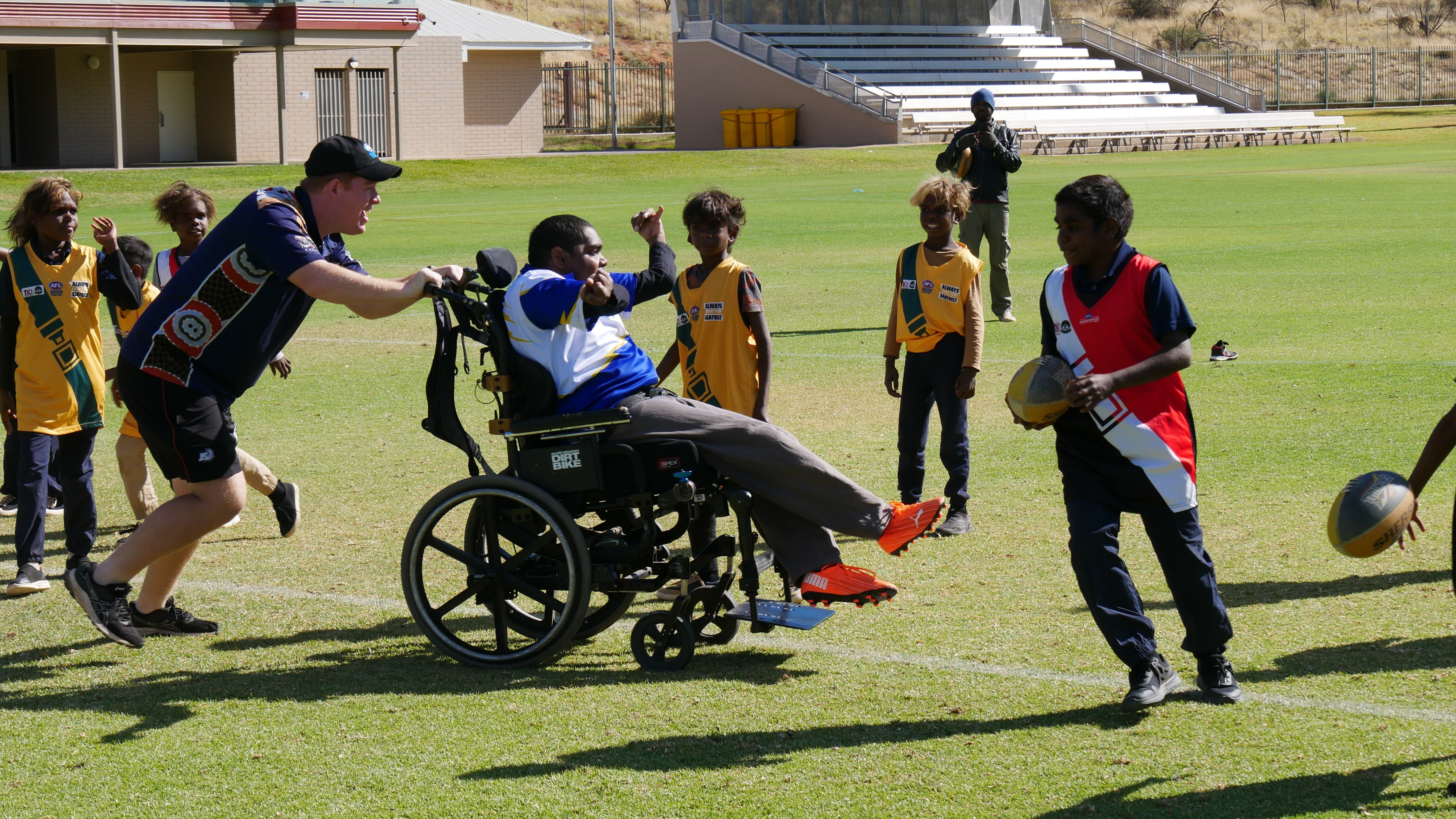 Inclusive sports program sees footballer in wheelchair kicking goals ...