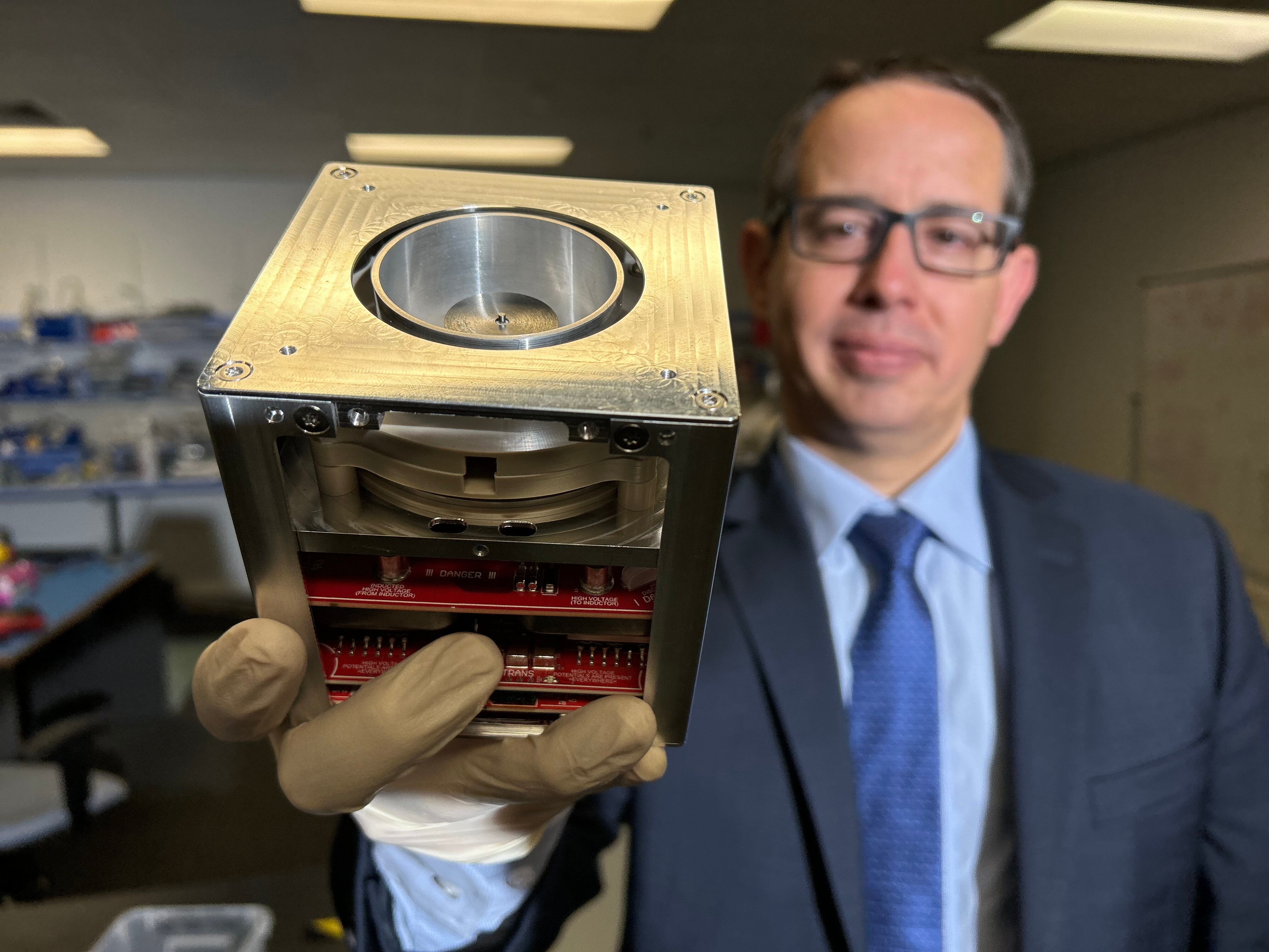 Space junk is causing clutter around the Earth, but a small cube could ...