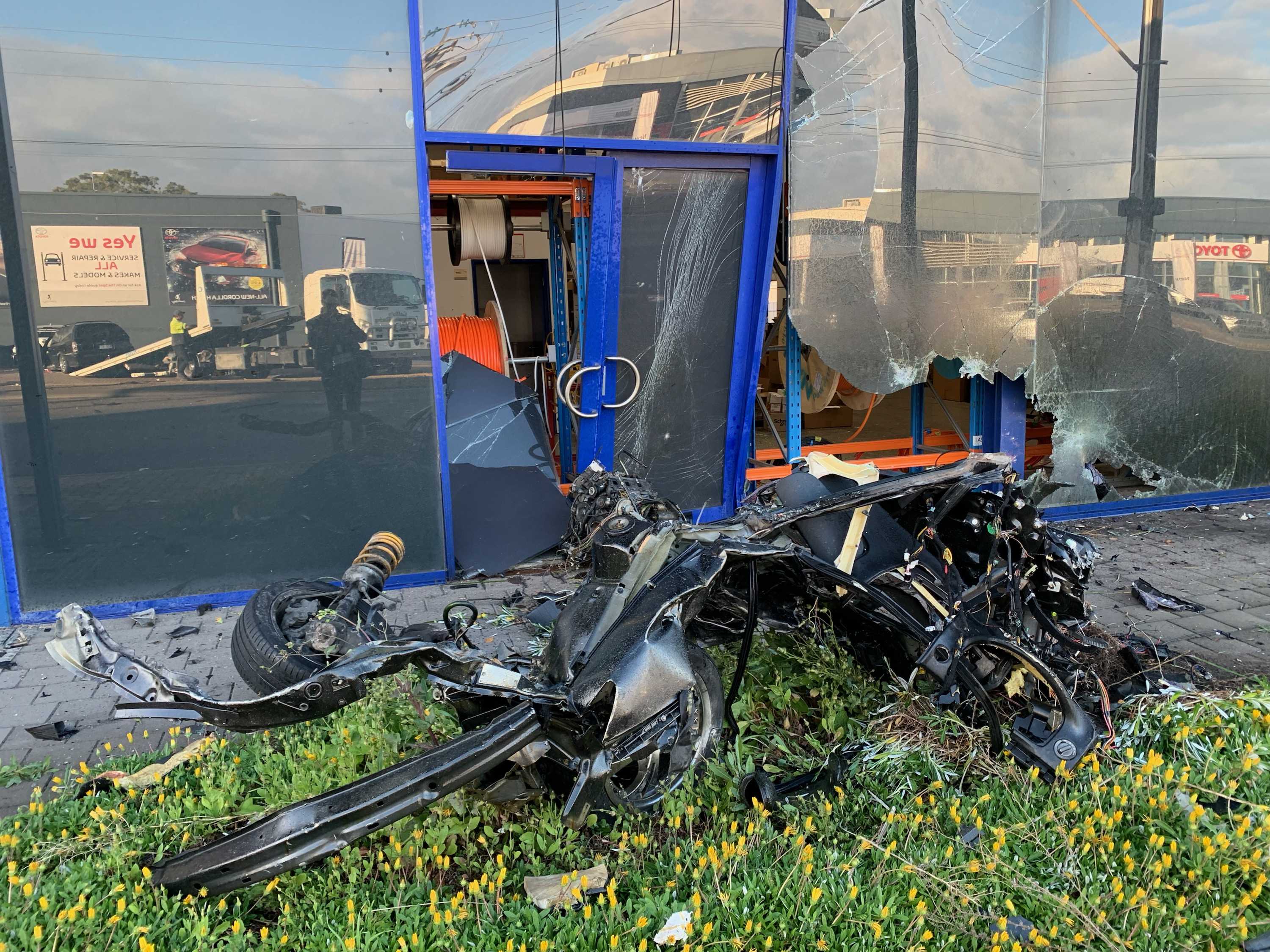 Car ripped in half in three-way crash that flung engine through ...