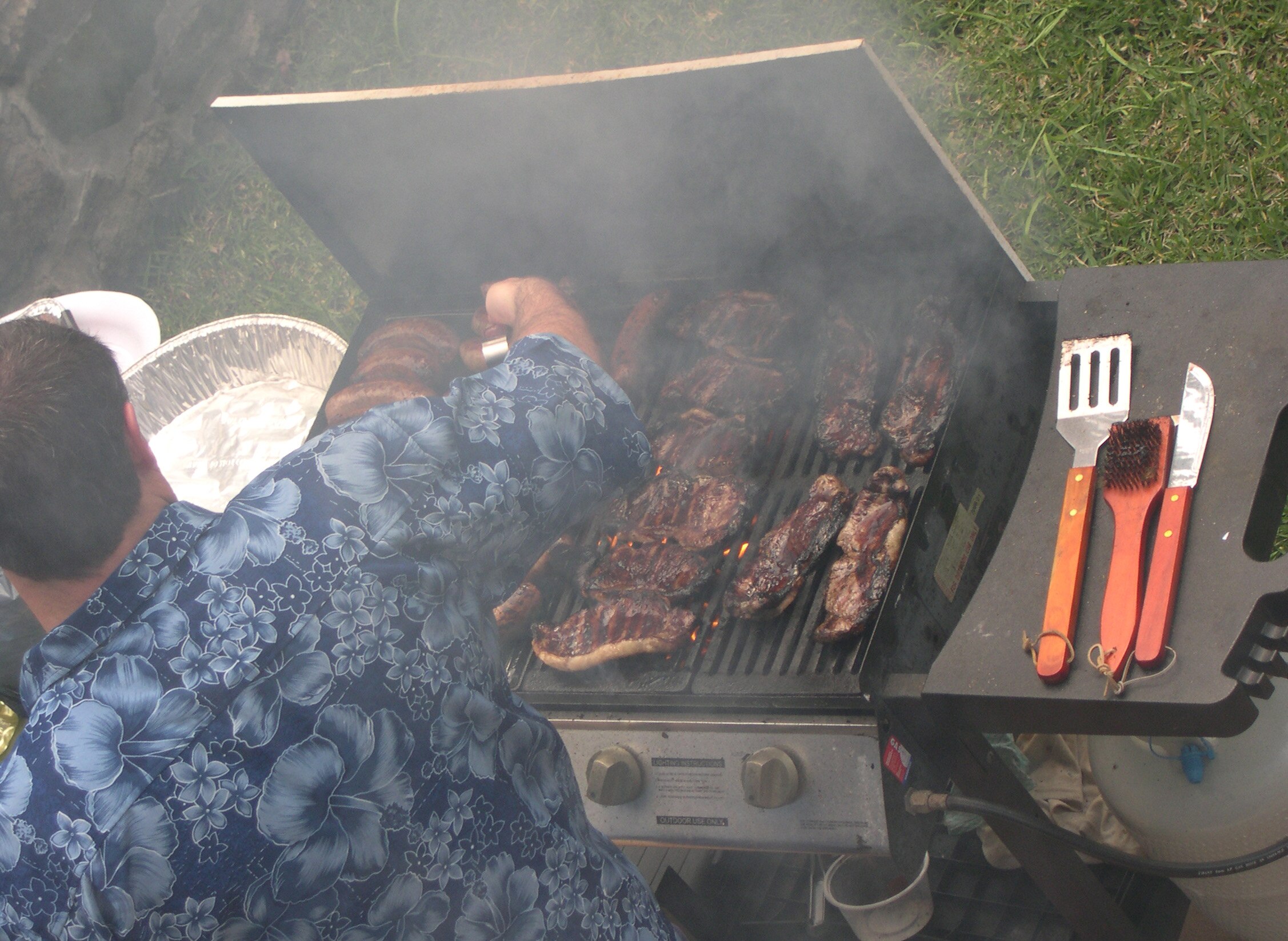 Men follow tradition by picking up the barbeque tongs - ABC News