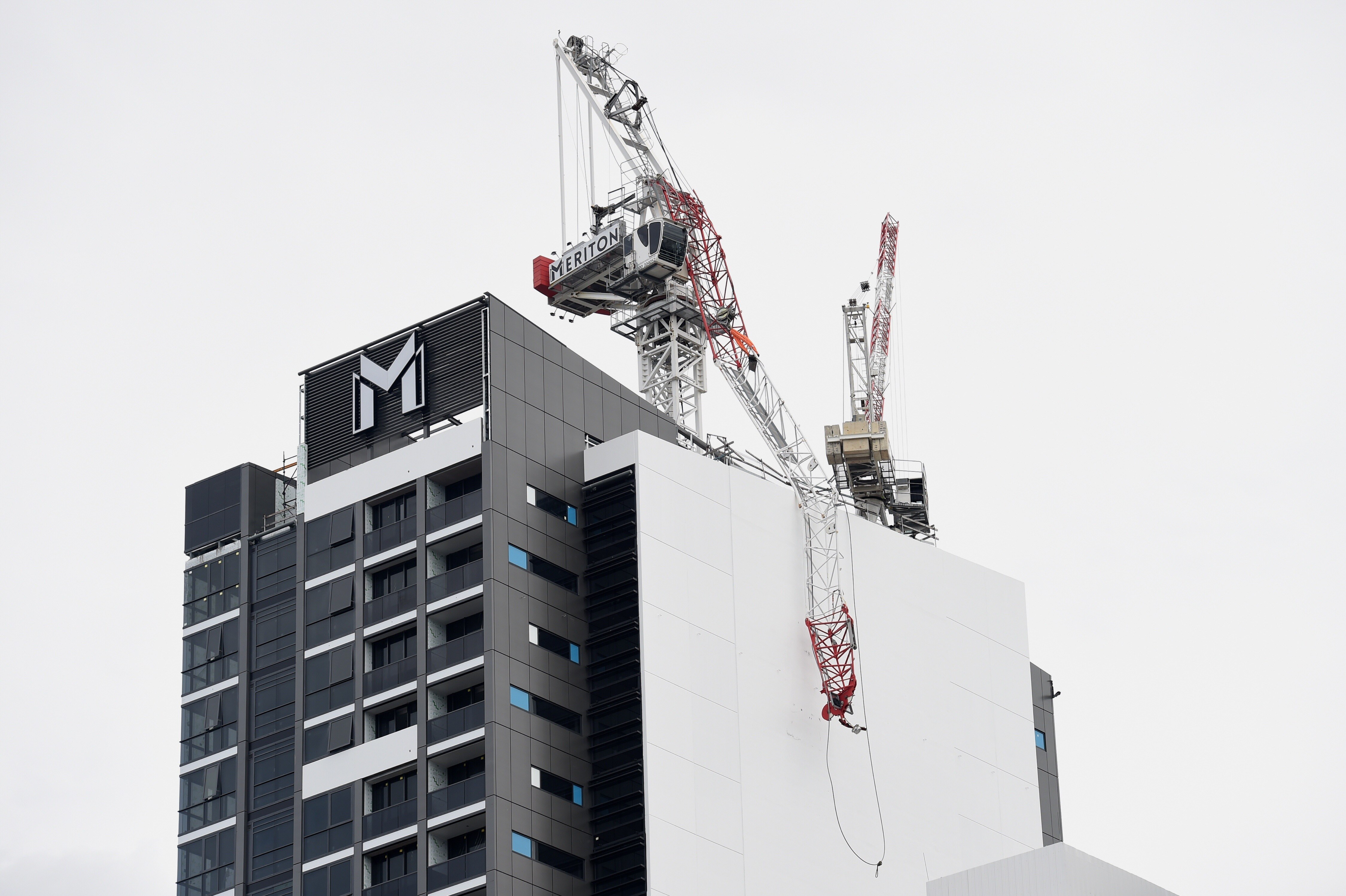 North Sydney crane collapse leaves workers hanging inside dangling boom ...