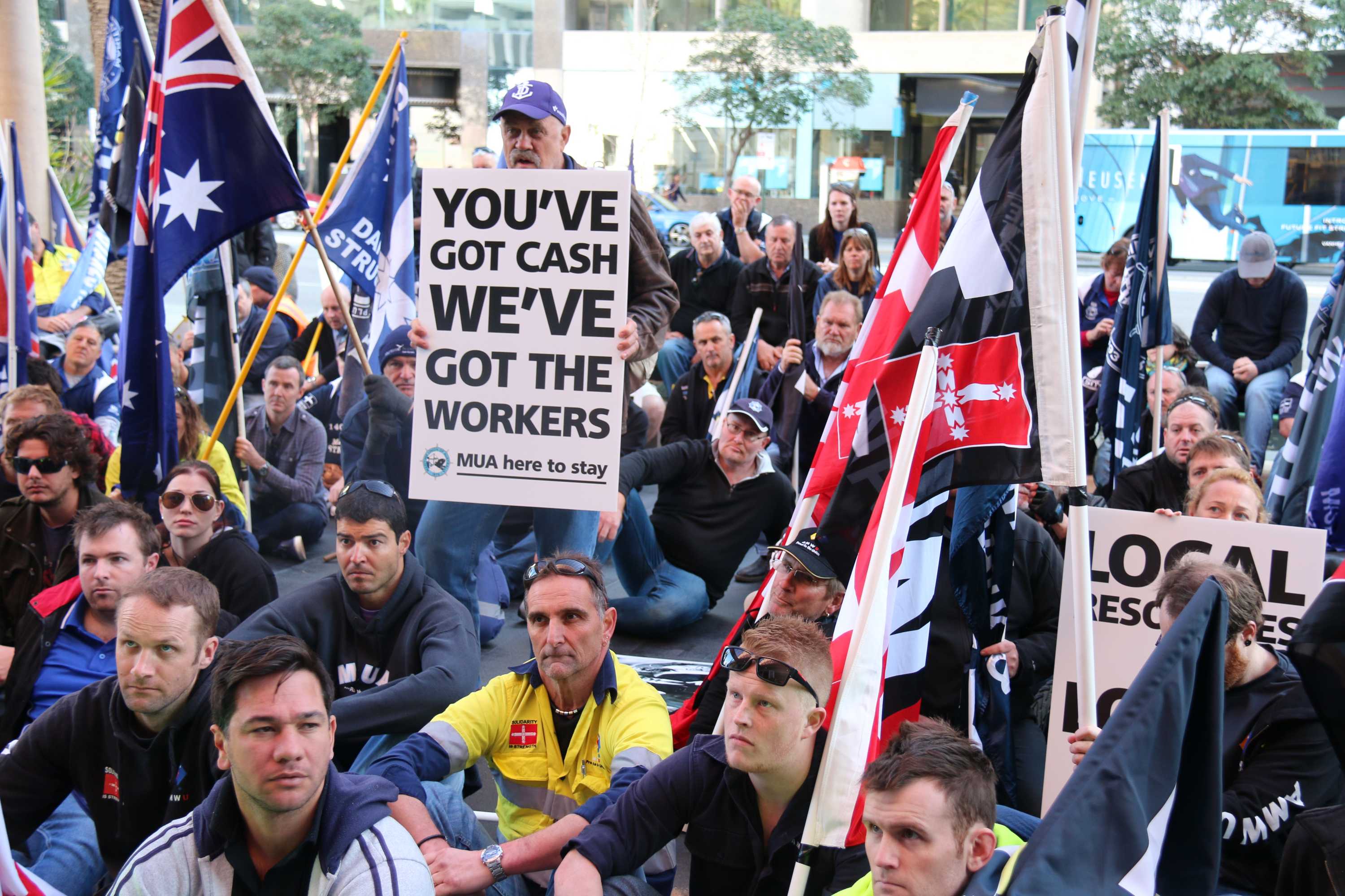 Union protest outside skilled migration forum in Perth CBD - ABC News