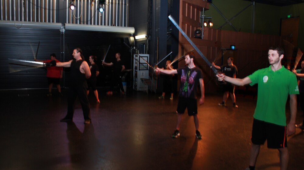 Combat fighting safely: Students use swords to transform their ...