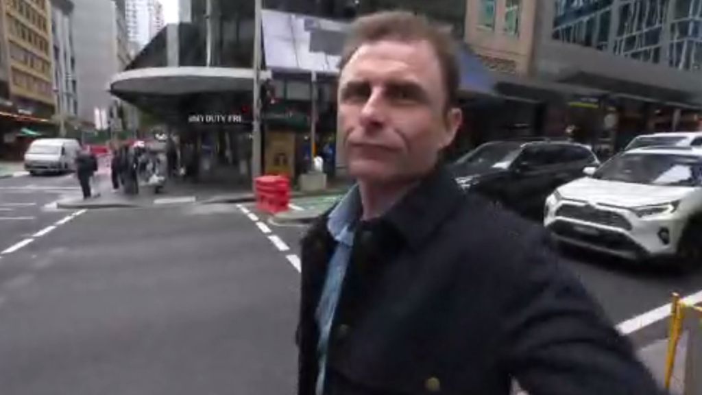 Daniel Muston pushes camera - ABC News