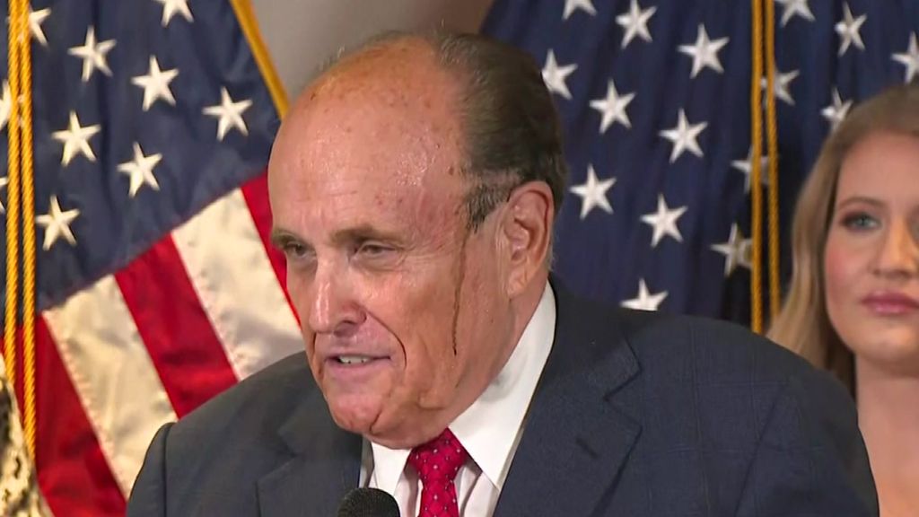 Rudy Giuliani appears to be sweating hair dye down his face during a ...