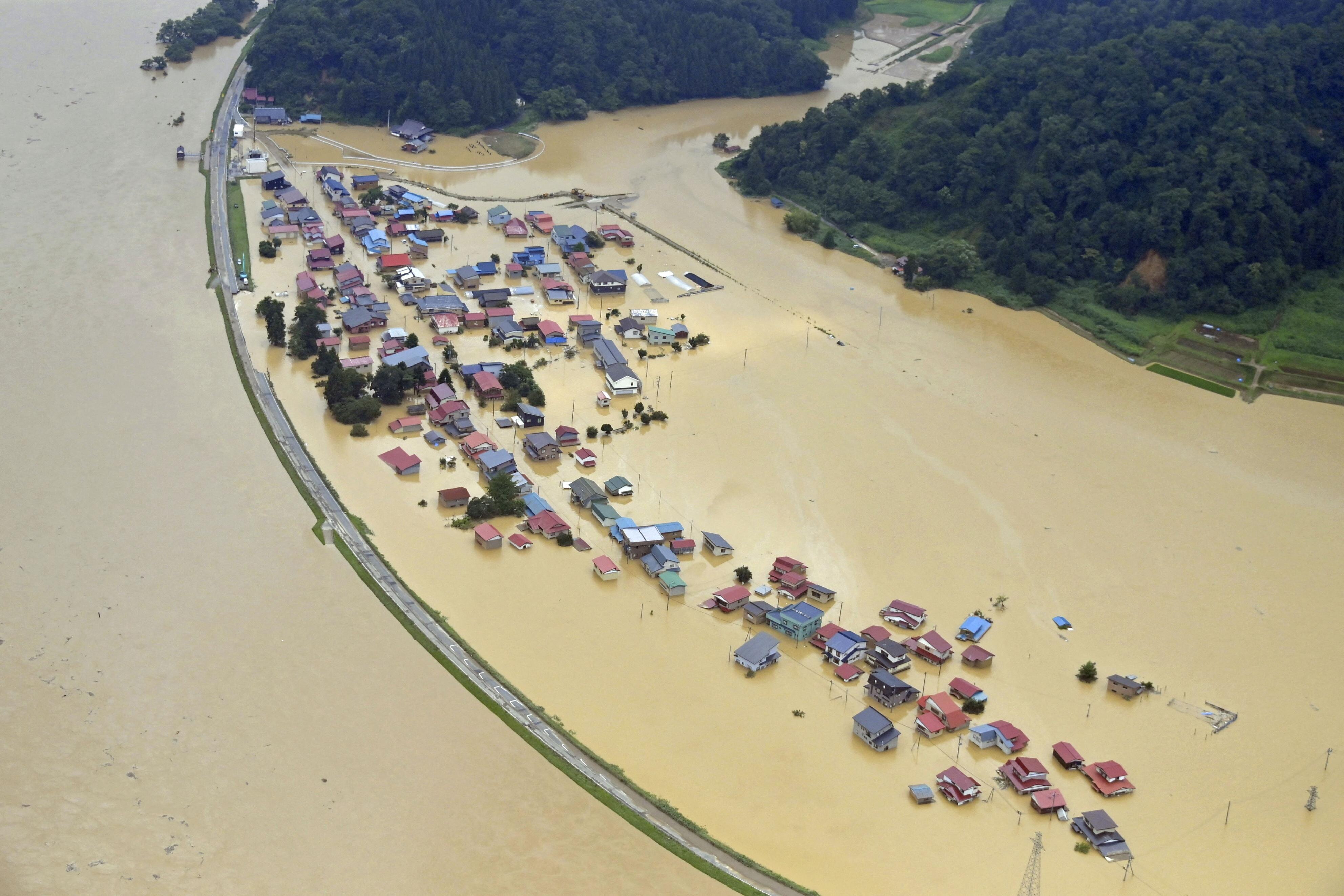 Record rainfall sees thousands evacuated in northern Japan as flooding ...