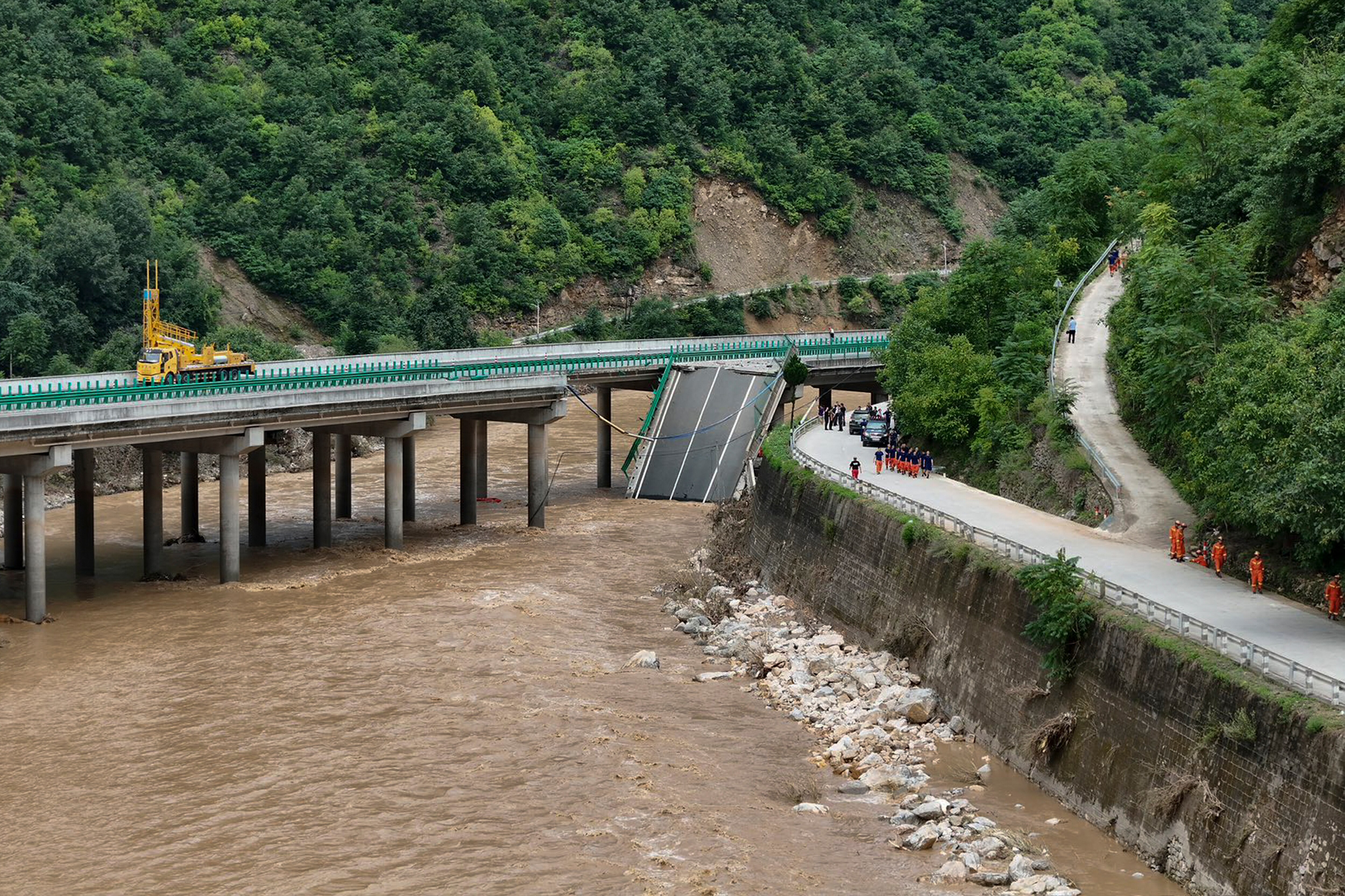 At least 12 killed and dozens missing after bridge collapses amid ...