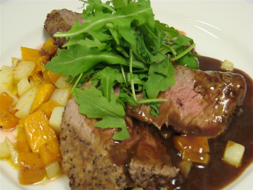 Herb crusted eye fillet served with a potato medley finished off with a ...