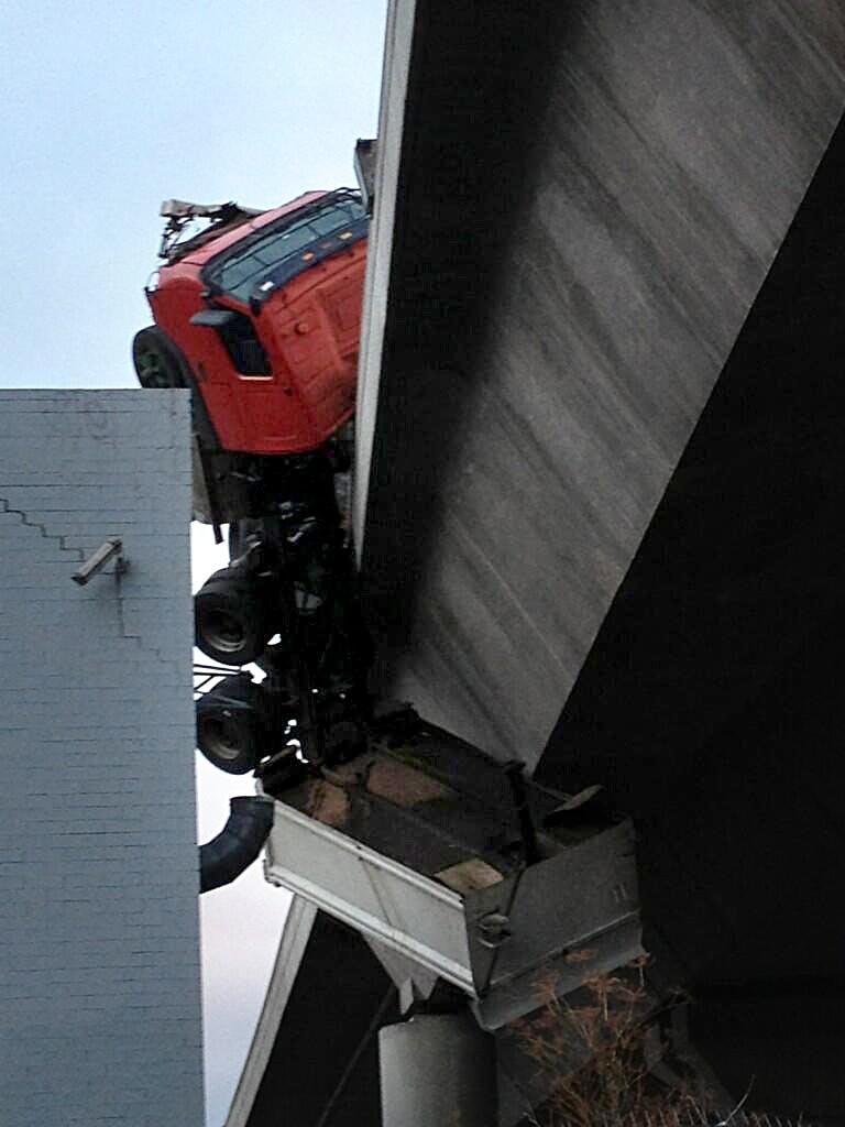 Driver falls 15m from bridge after truck crash - ABC News