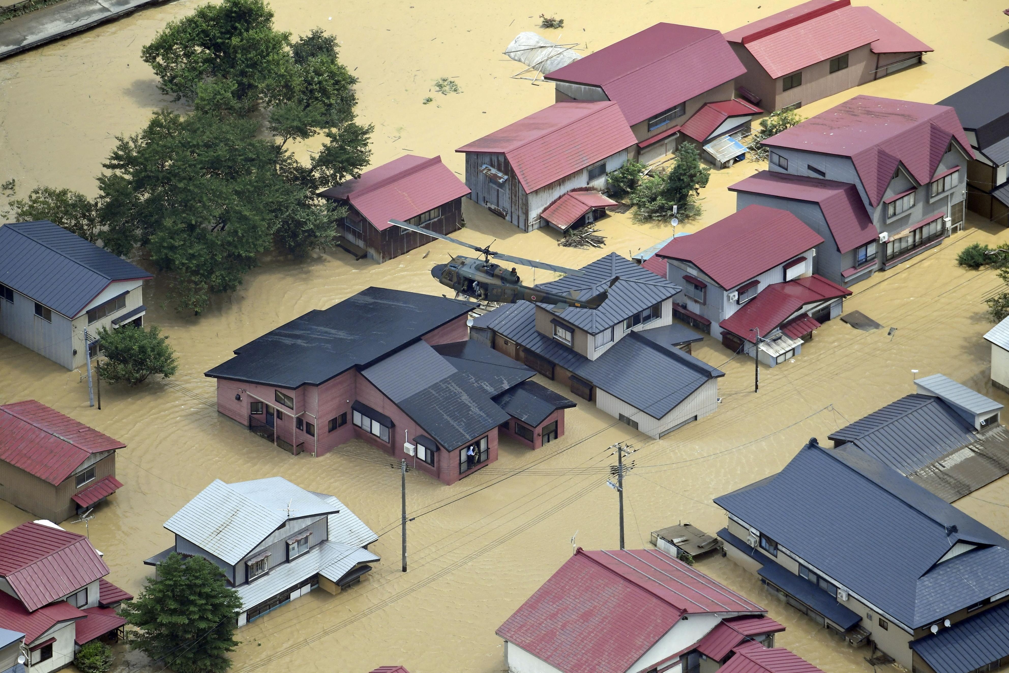 Record rainfall sees thousands evacuated in northern Japan as flooding ...