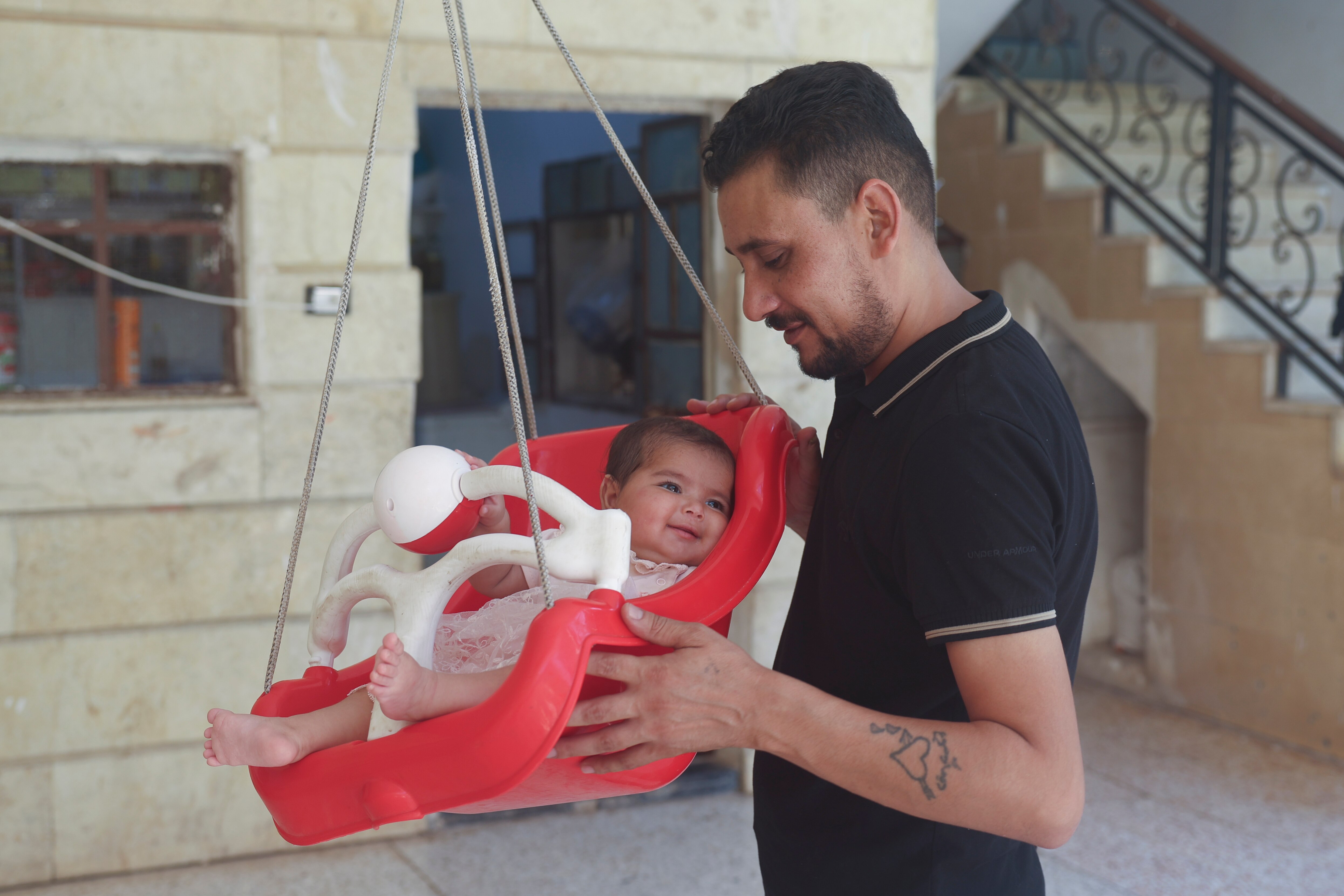 Syrian baby born under earthquake rubble turns six months, happily ...