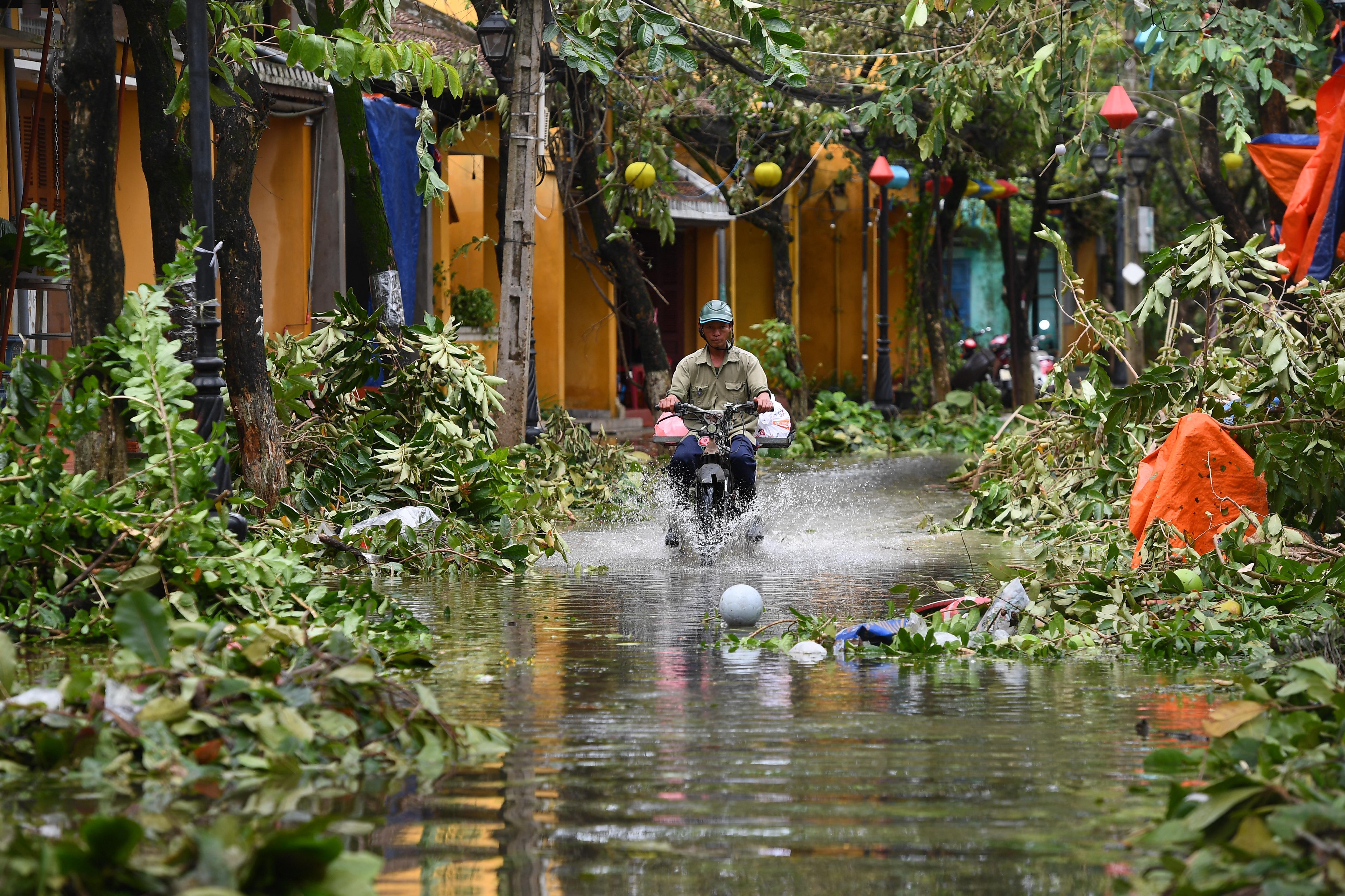Vietnam imposes curfew, shuts airports as Typhoon Noru hits country ...