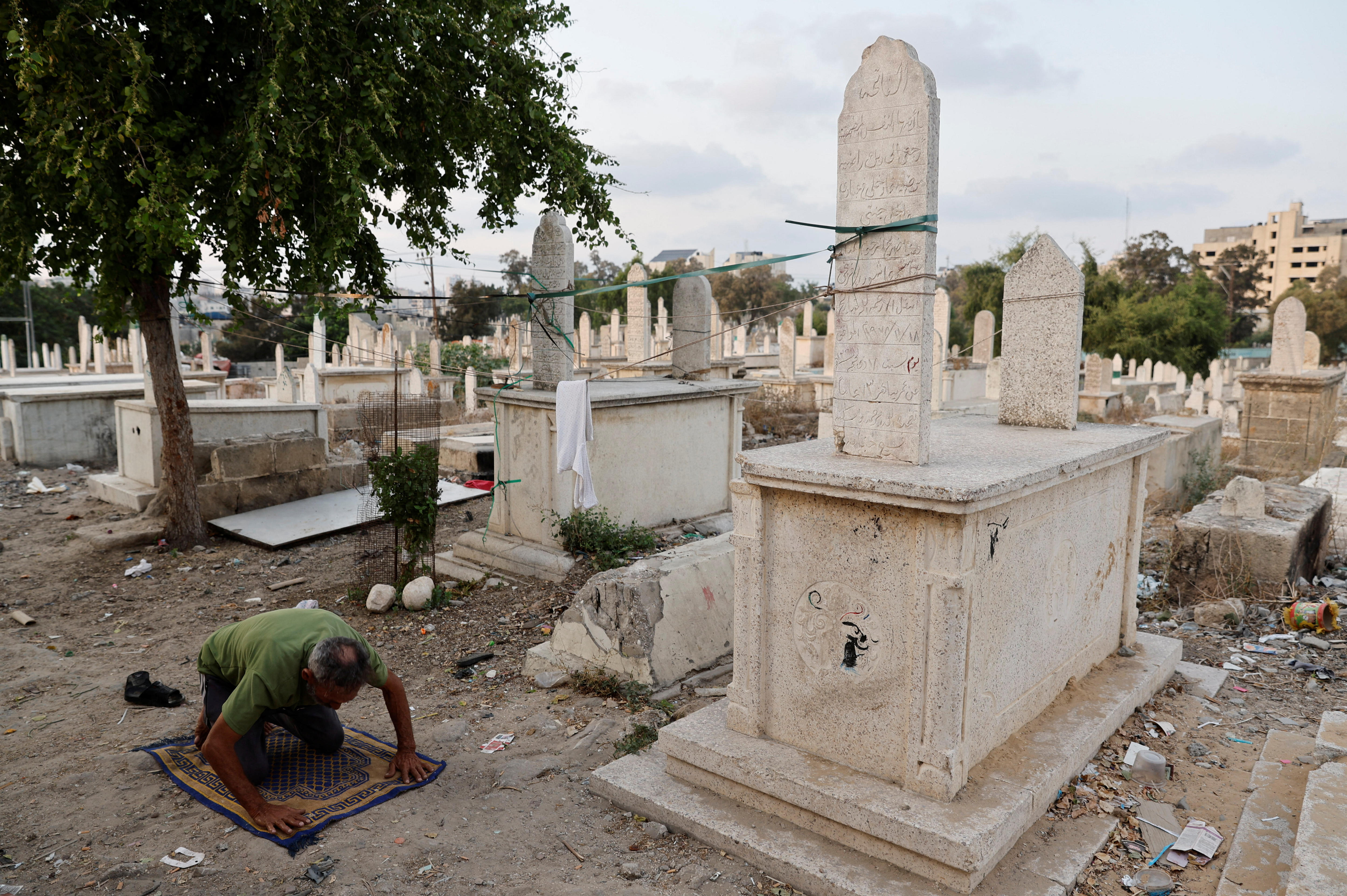 Authorities say cemeteries are full as families build homes among graves, amid struggle for land ...