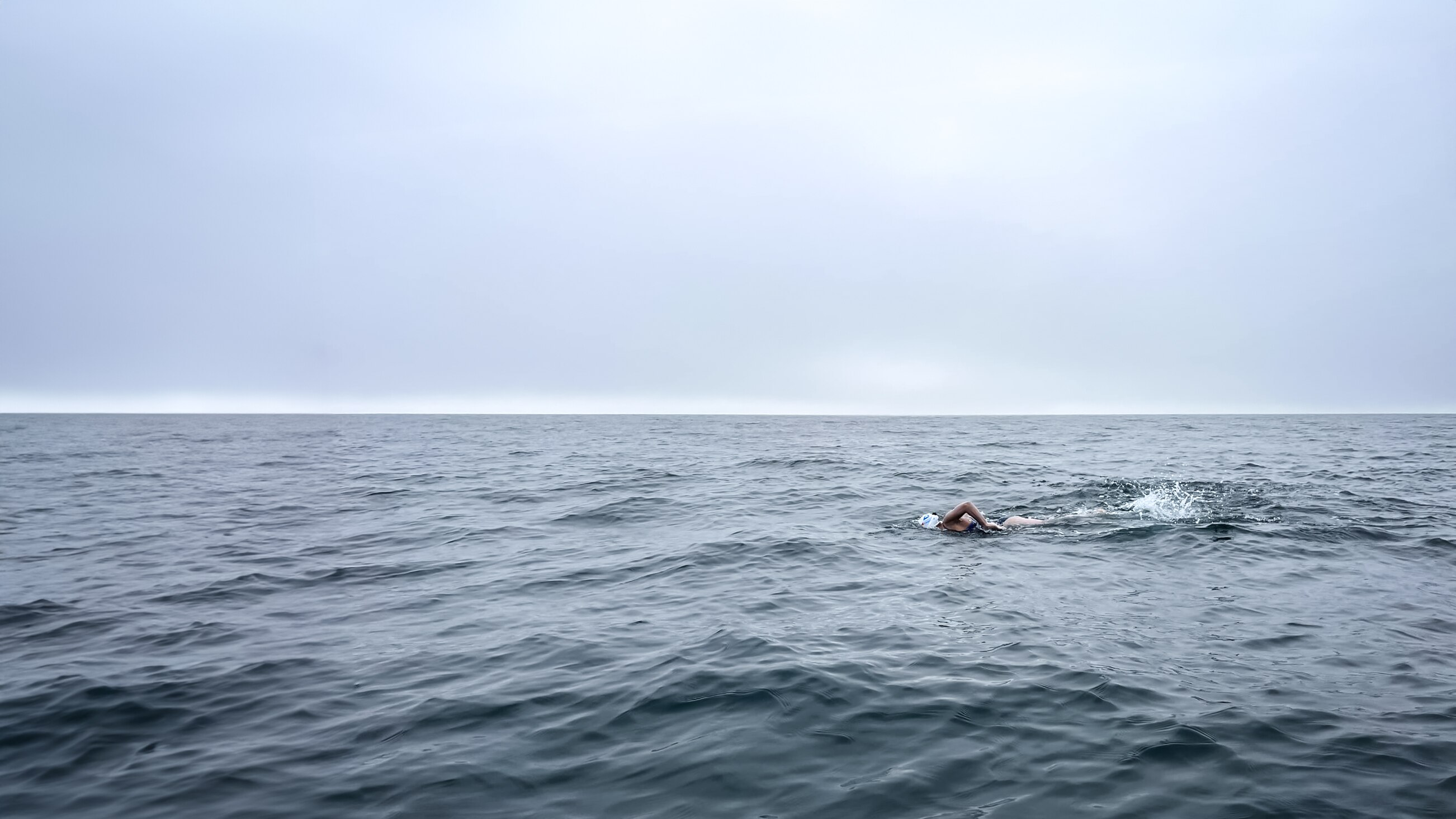 Teacher takes on world’s toughest long-distance ocean swim - ABC listen
