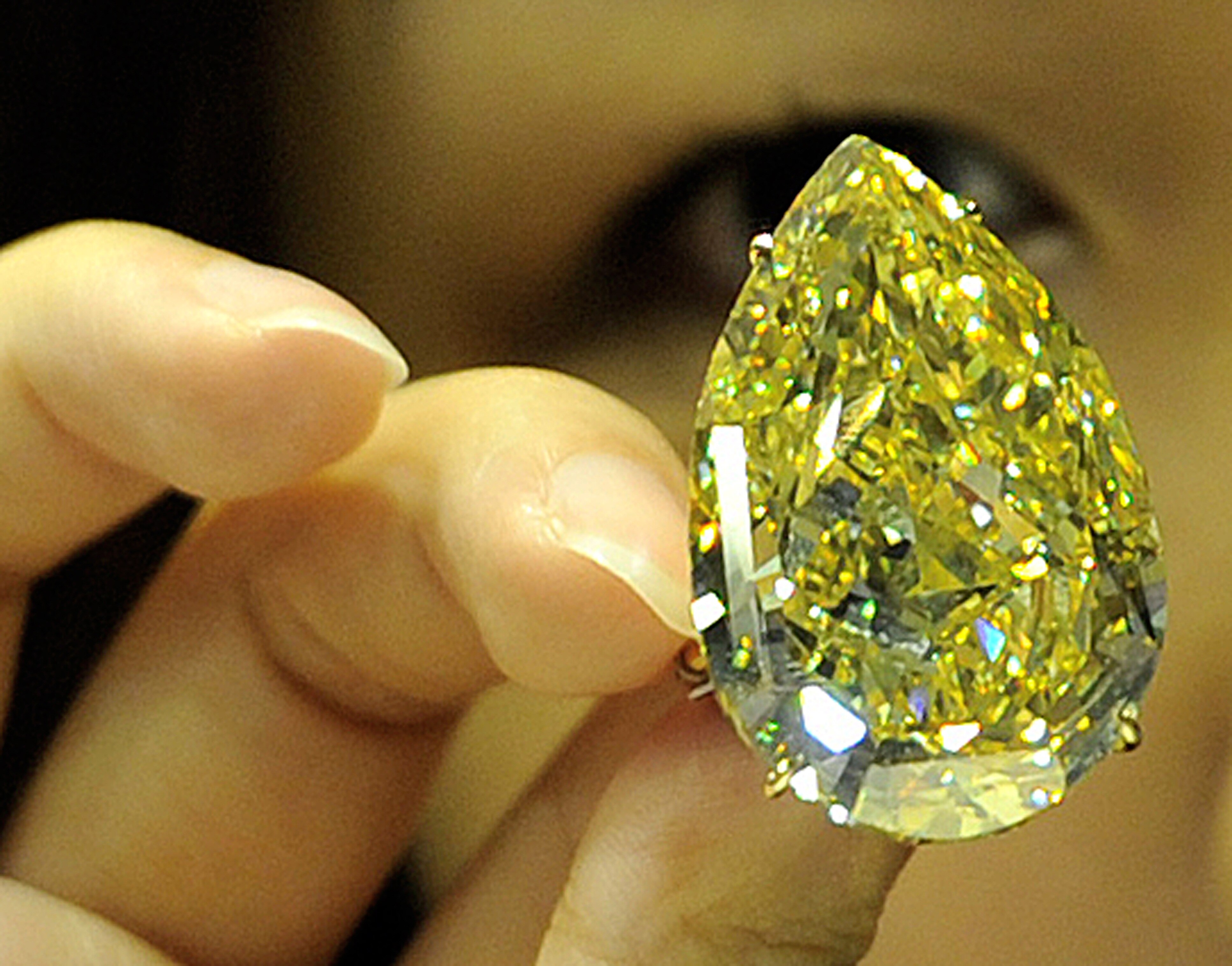 World's biggest yellow diamond fetches record price - ABC News