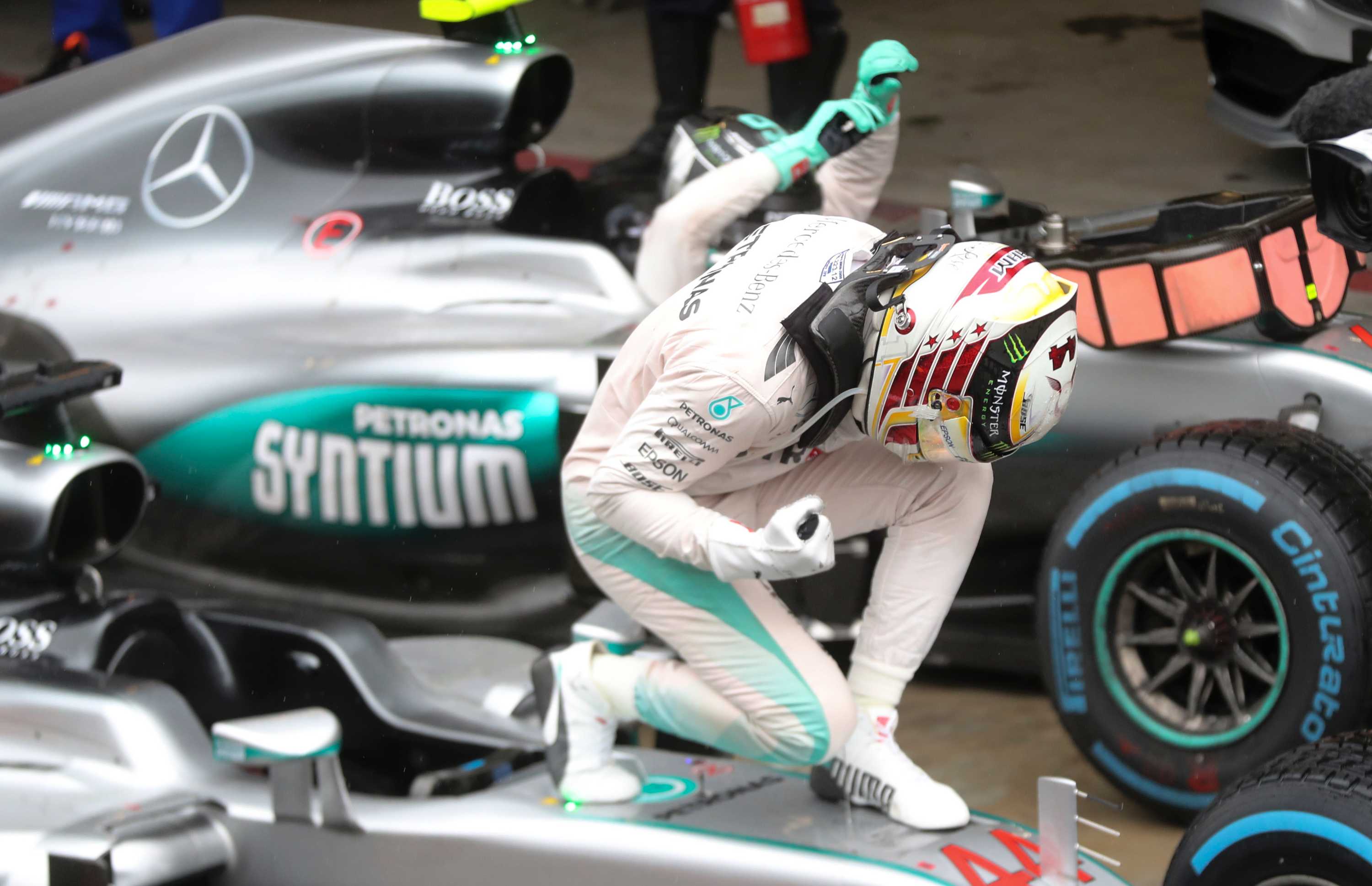Lewis Hamilton wins Brazilian Formula One grand prix over Nico Rosberg ...