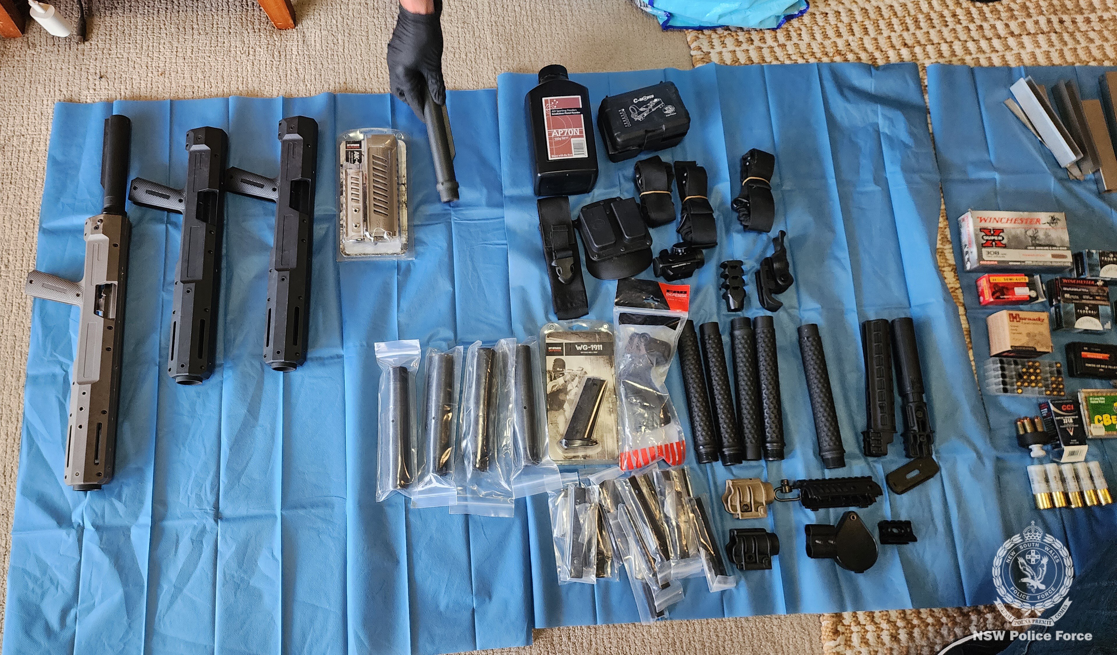 Man, teen charged after police seize homemade guns, 3D printer in NSW ...