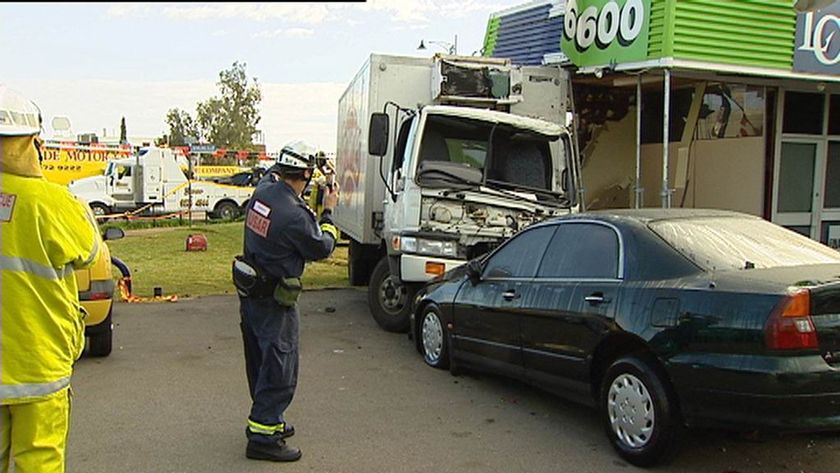 Milk truck crashes into car dealership - ABC News