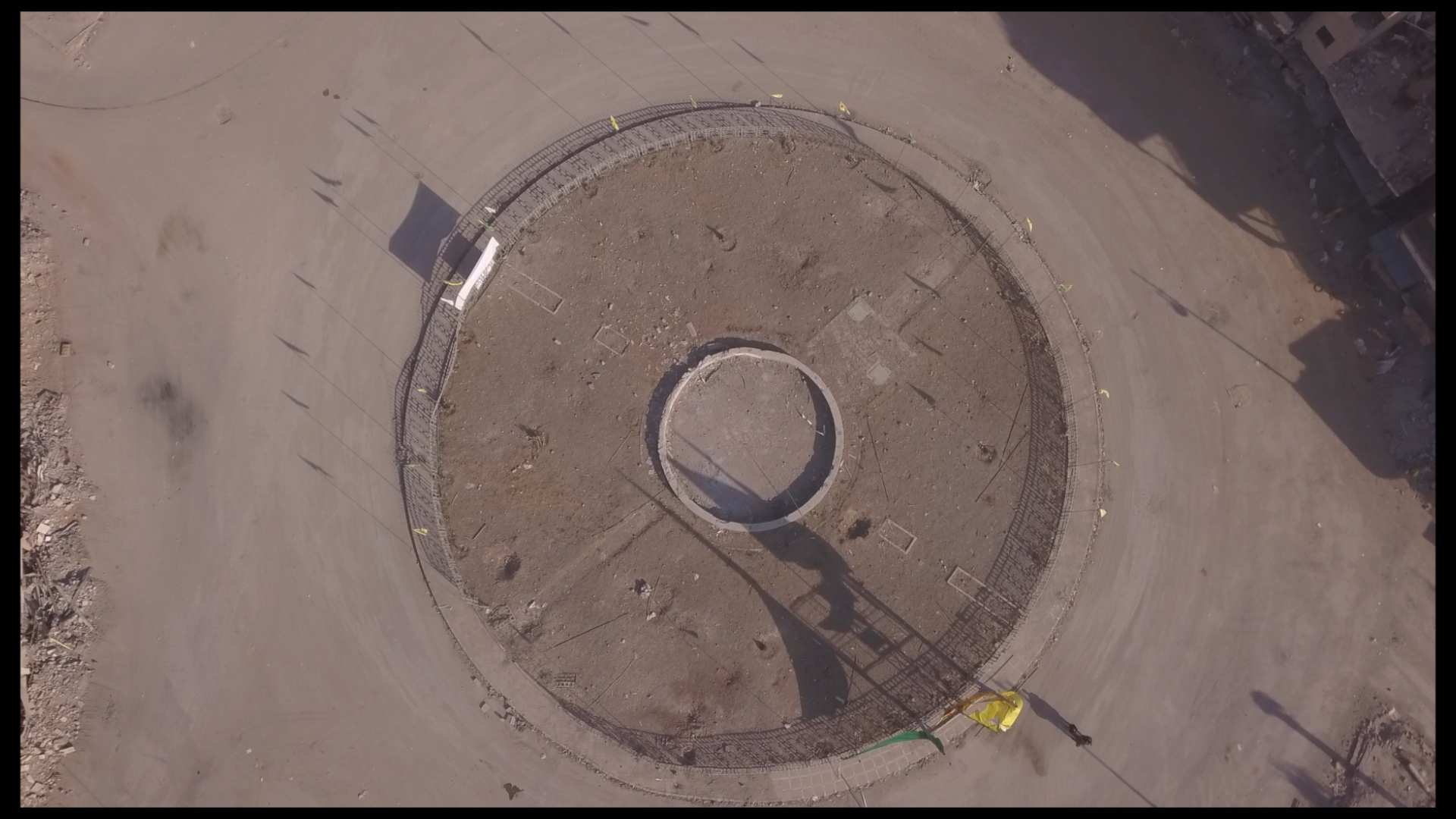 An aerial view of Raqqa's Naim Square pans over the destroyed city ...