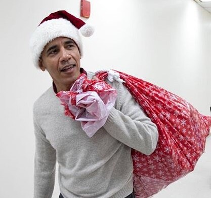 Barack Obama fills in for Santa Claus during surprise Christmas visit ...