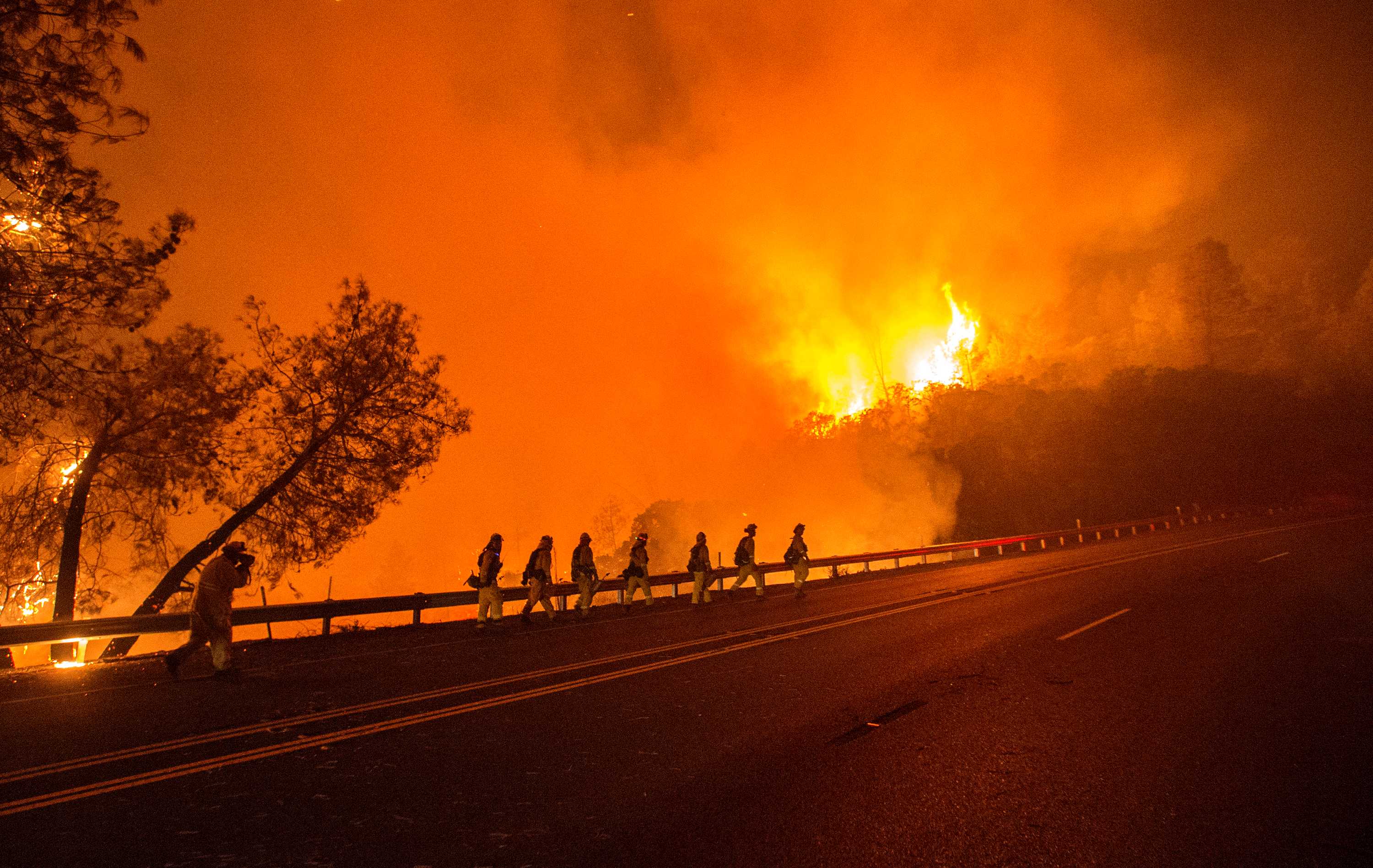 Wildfires rage across California, leaving one firefighter dead and ...
