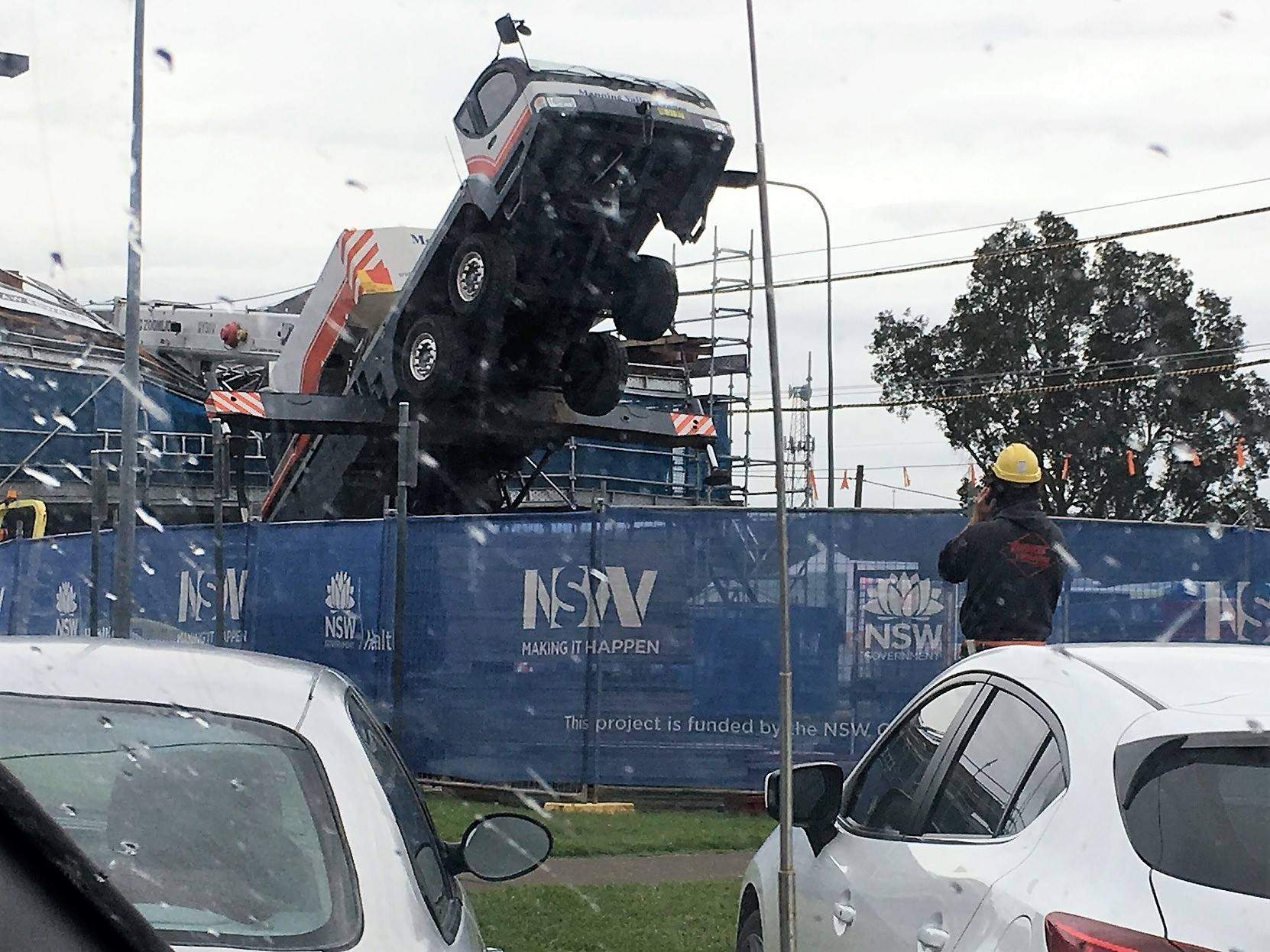 Driver escapes serious injury as crane topples over at Taree hospital ...