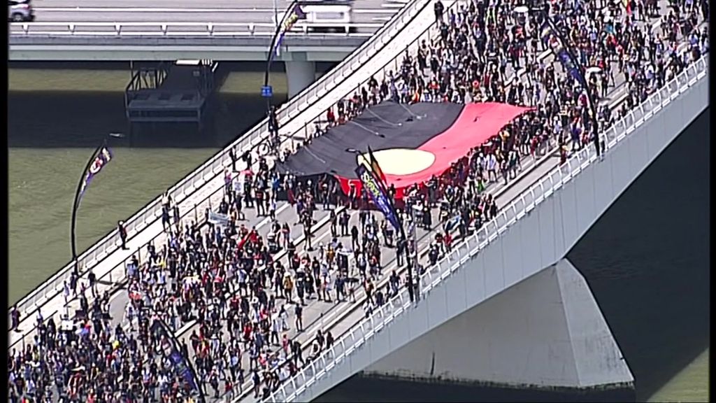 Protesters attend Invasion Day rally in Brisbane - ABC News