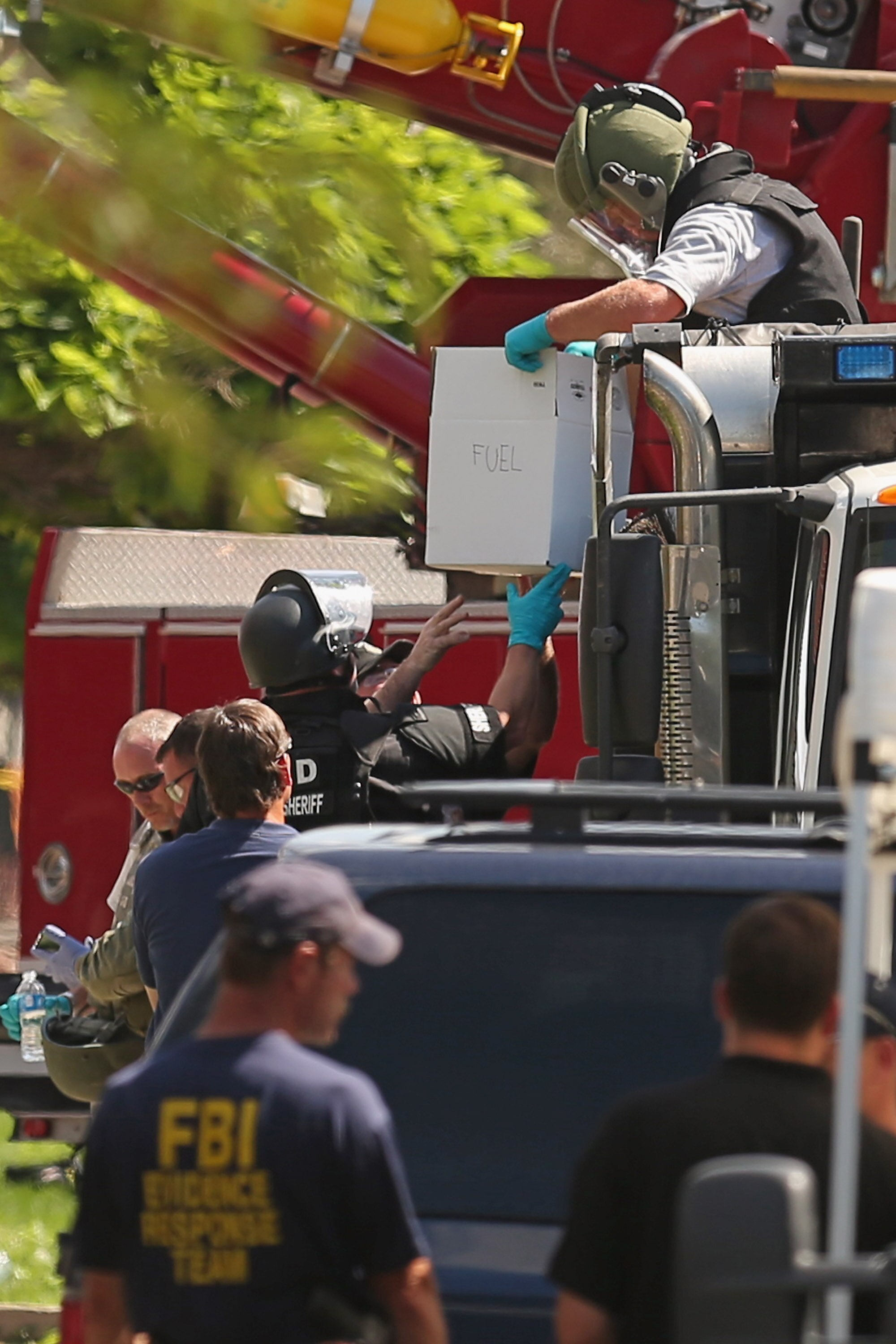 Booby traps removed as shooting victims named - ABC News