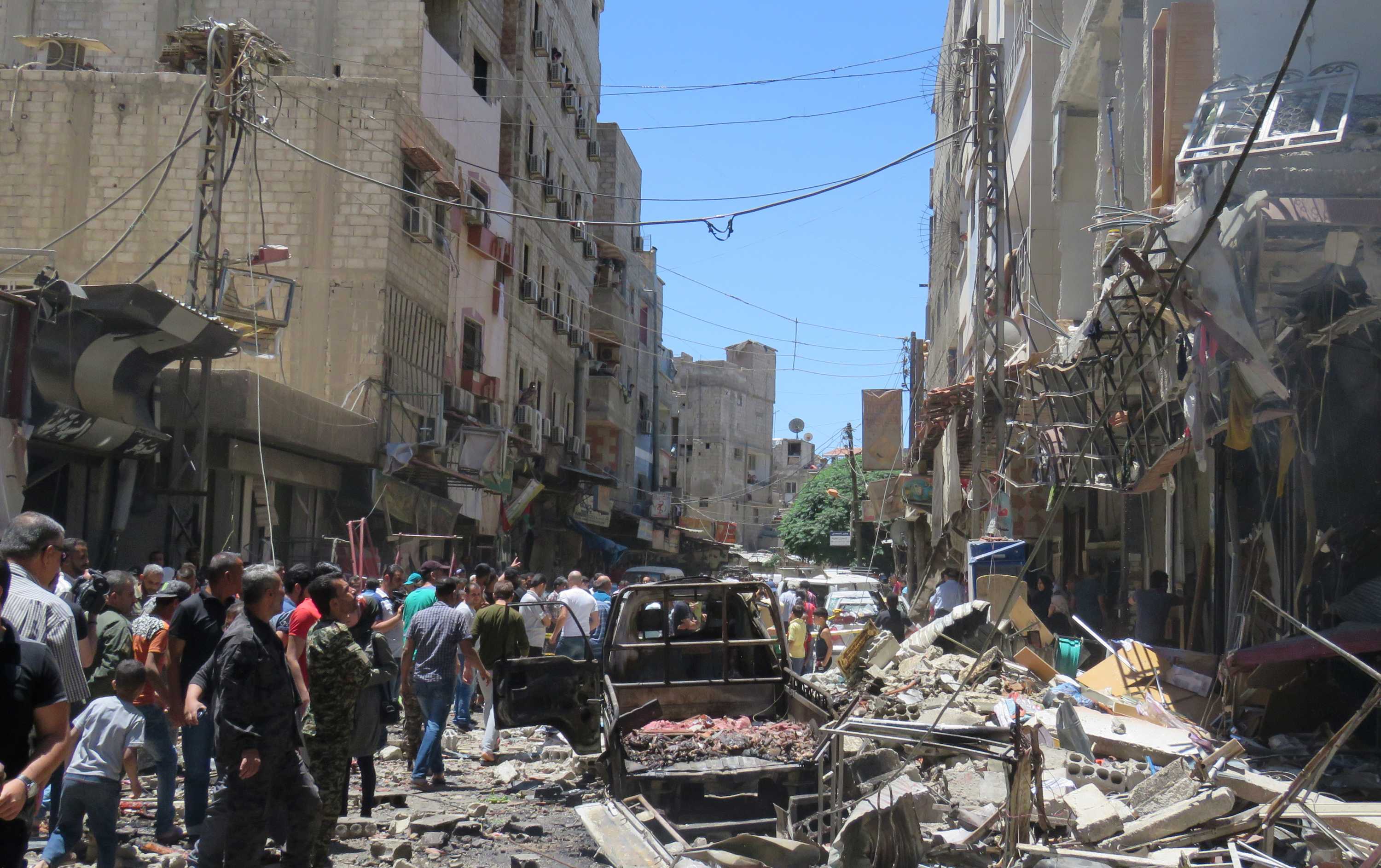 Syrian conflict: Twin suicide bombers target revered shrine near ...