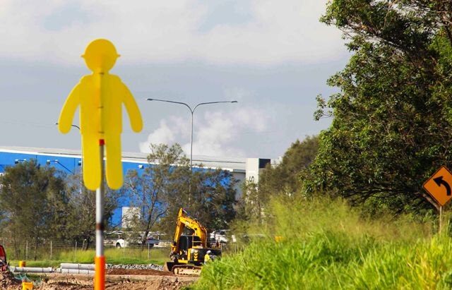 Brisbane's bright yellow men keep road workers safe - ABC News