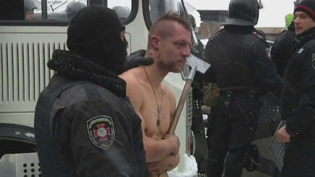Ukraine unrest: Naked protester mocked by police as European leaders ...