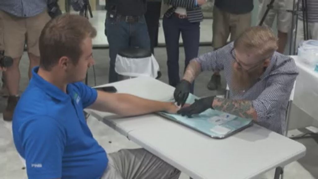 Tech company employees get microchip implants at 'chip party' - ABC News