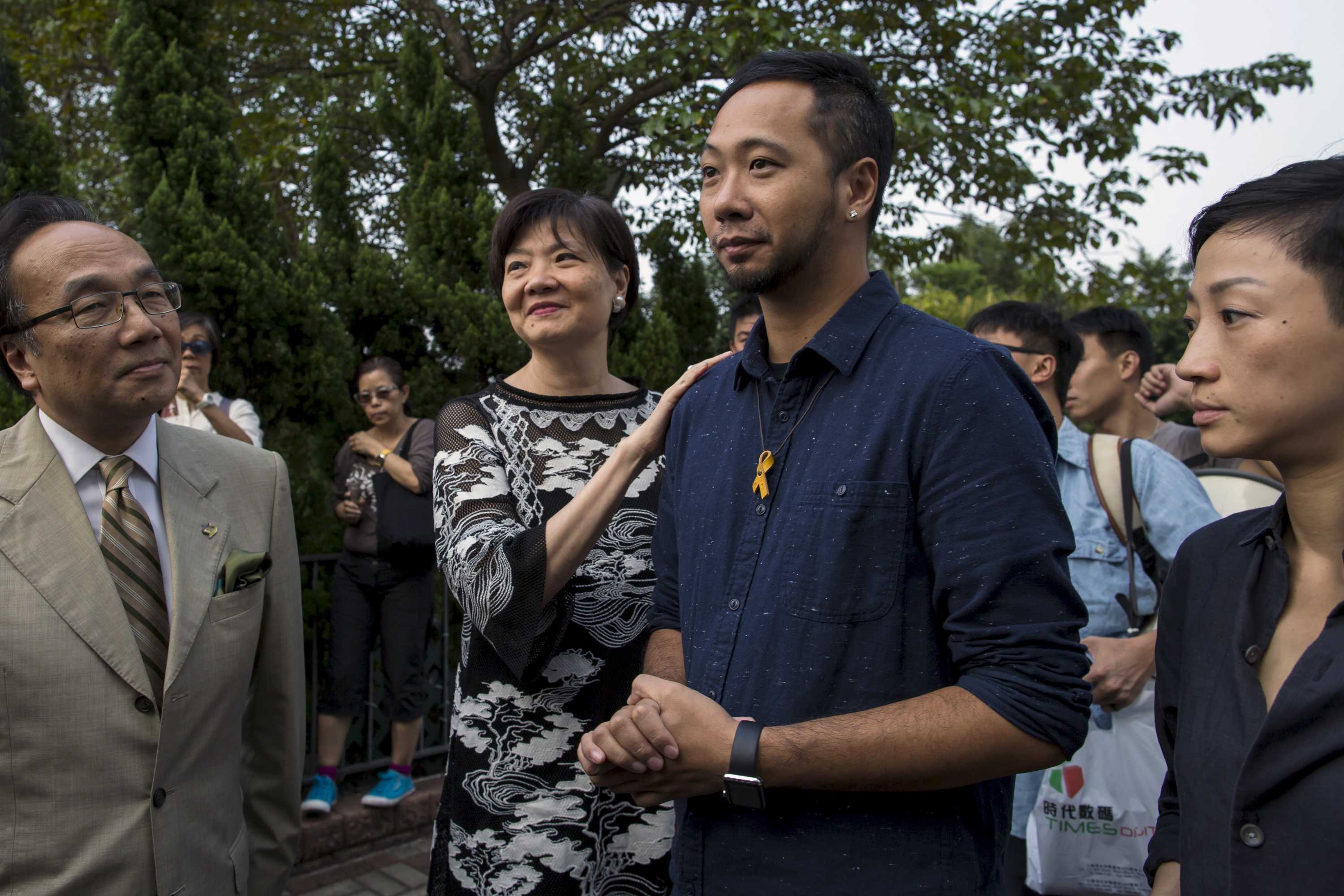 Seven Hong Kong police, activist charged over beating during pro ...