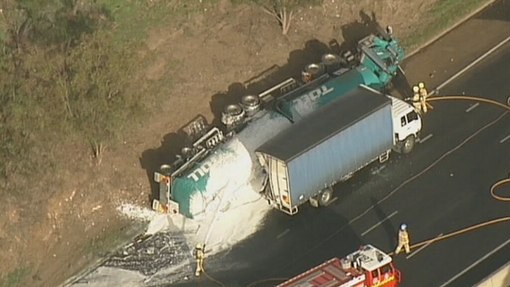 Calder Freeway crash: One dead after petrol tanker rolls, fuel spilt ...