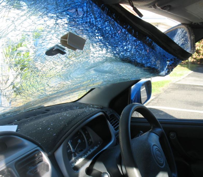 Cars damaged, windscreens shattered after large rocks thrown at moving ...