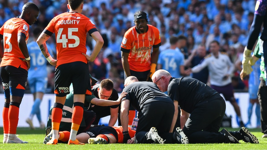 Luton Town captain Tom Lockyer collapses on the field before team's ... Luton Town captain Tom Lockyer collapses on the field before team's ...