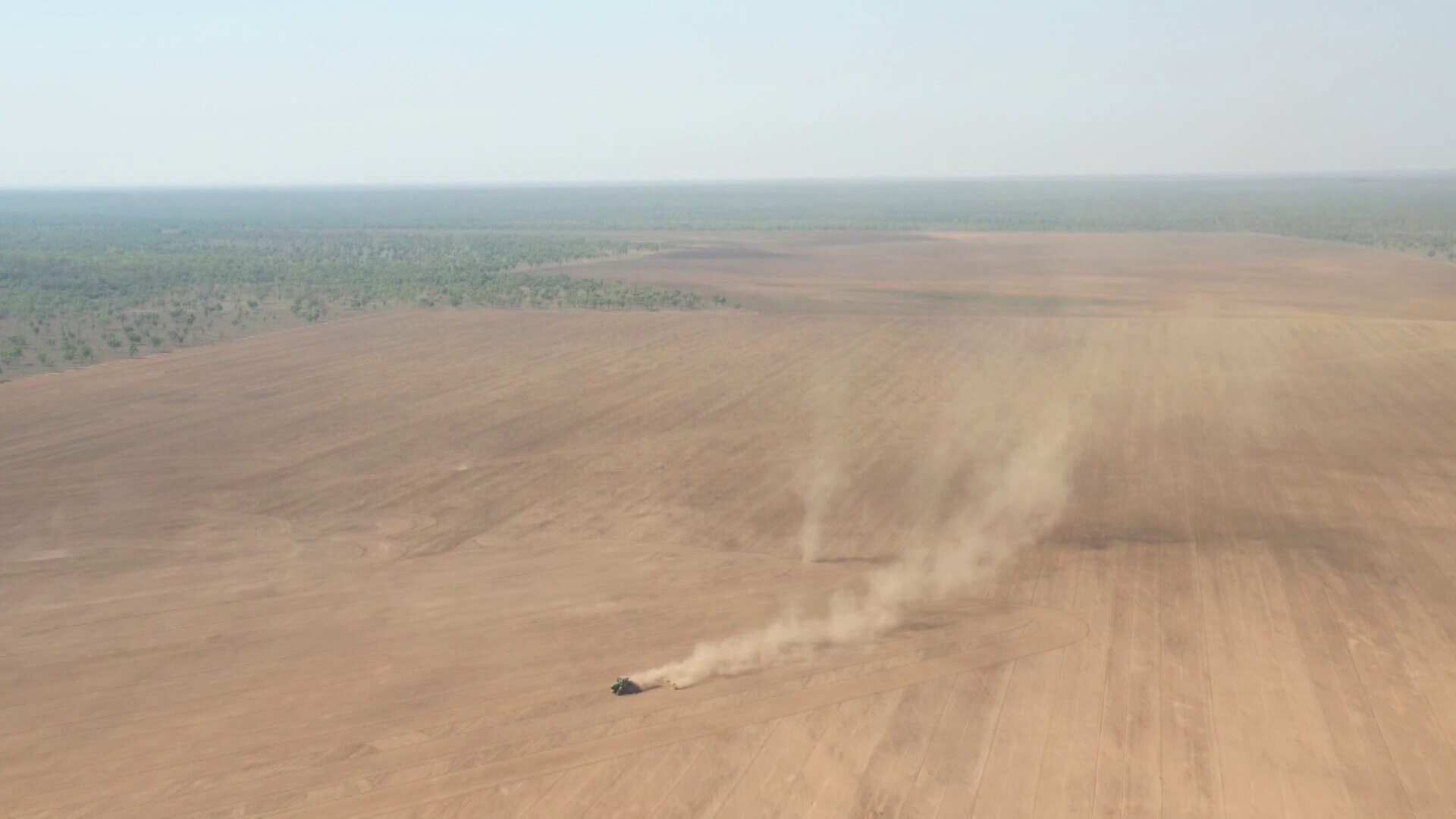 Aerial view of a disc plough breaking up freshly cleared land - ABC News