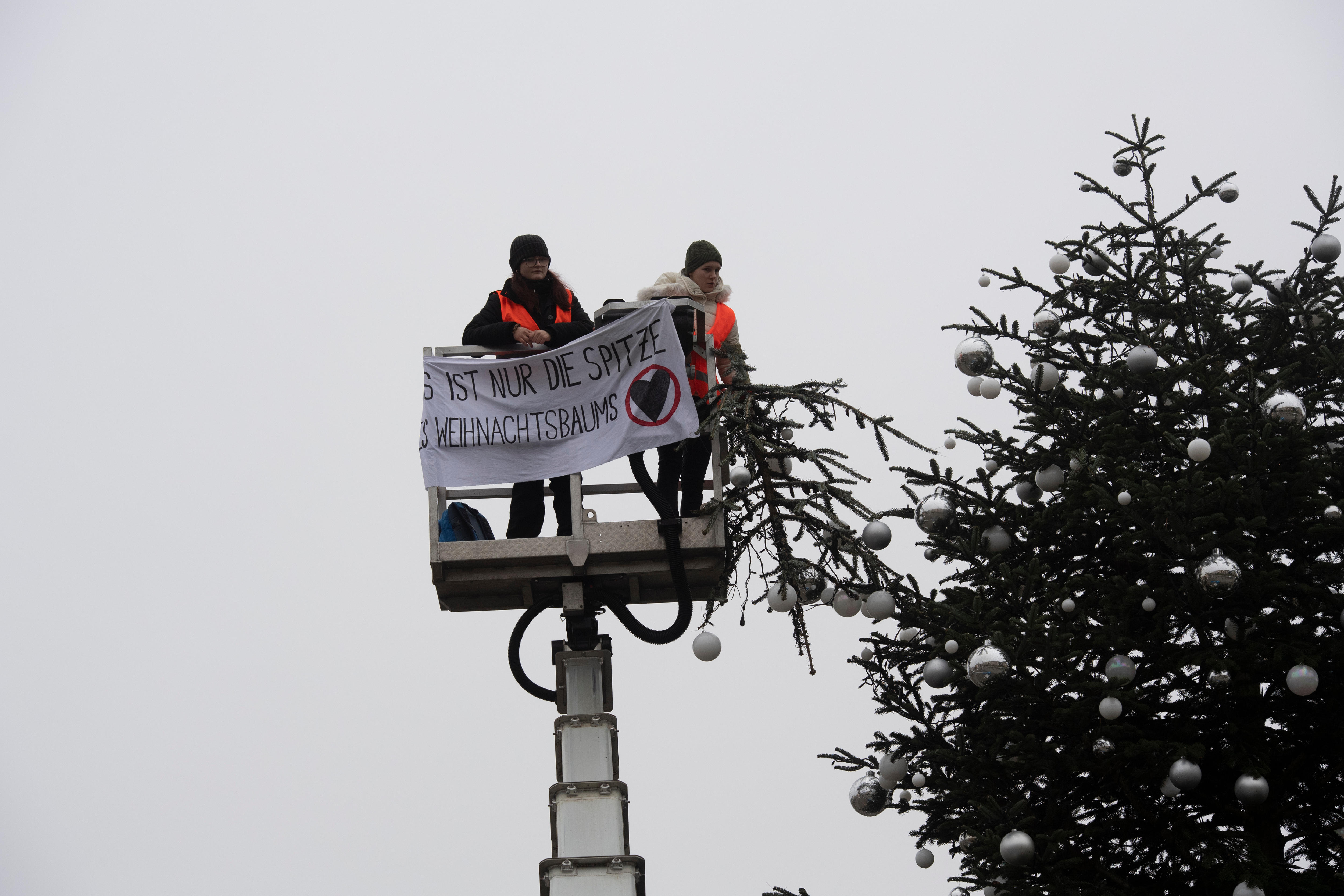 Last Generation climate activists use hydraulic lift to remove top of ...