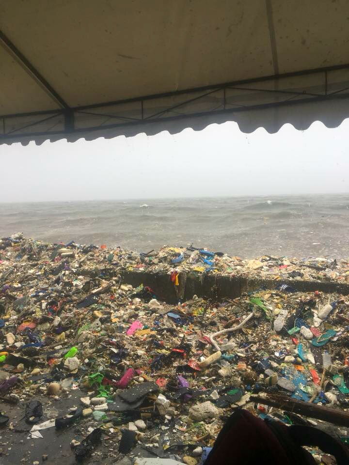 Footage shows volunteers struggling to stop waves of garbage washing ...