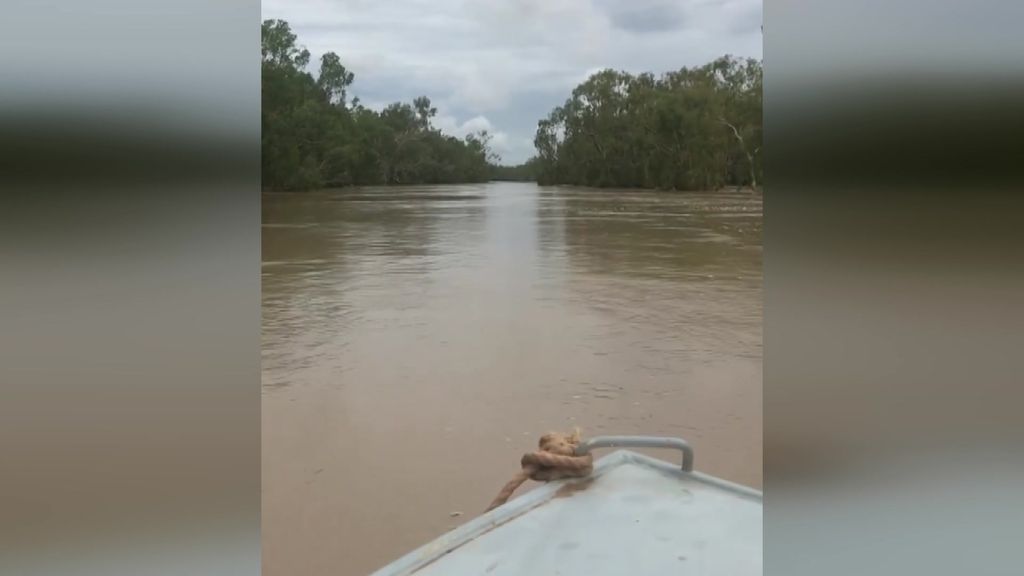 Crossing a flooded river on the way to Charters Towers. - ABC News