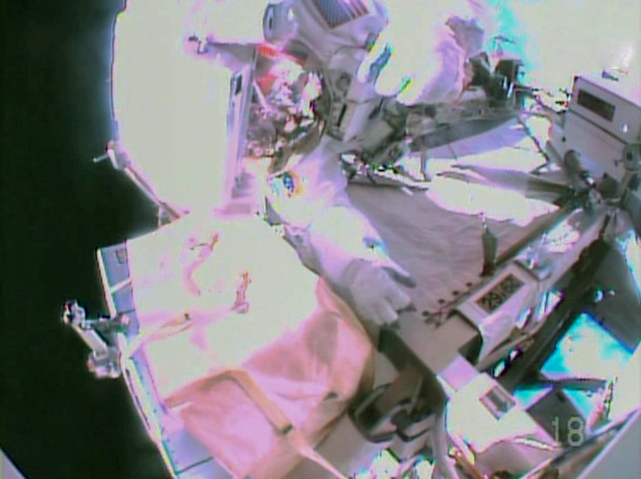 US astronauts race the clock on spacewalk to make repairs to ...