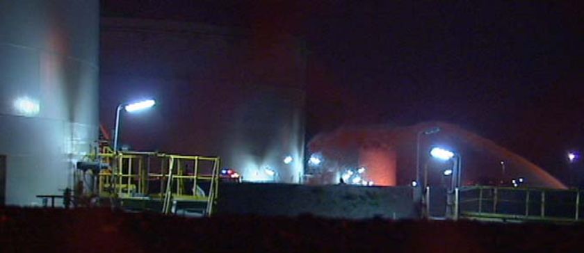 Fire crews clean up refinery tank leak - ABC News