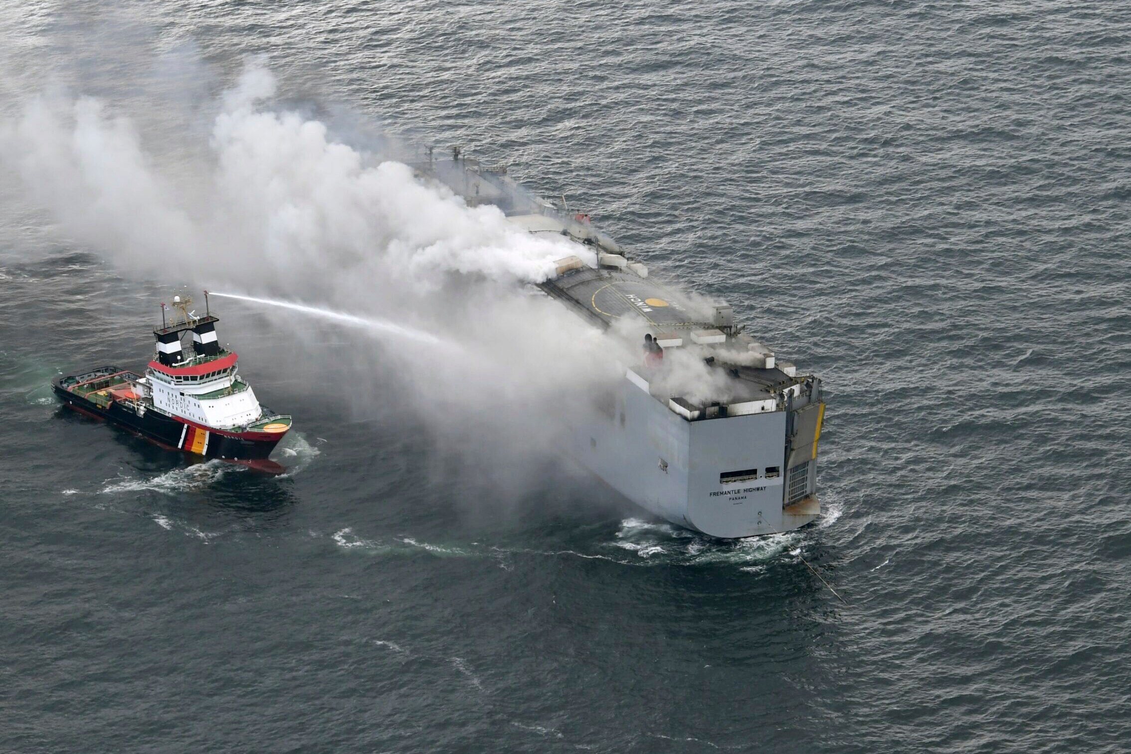 Freighter carrying nearly 3,000 cars catches fire in the North Sea off ...