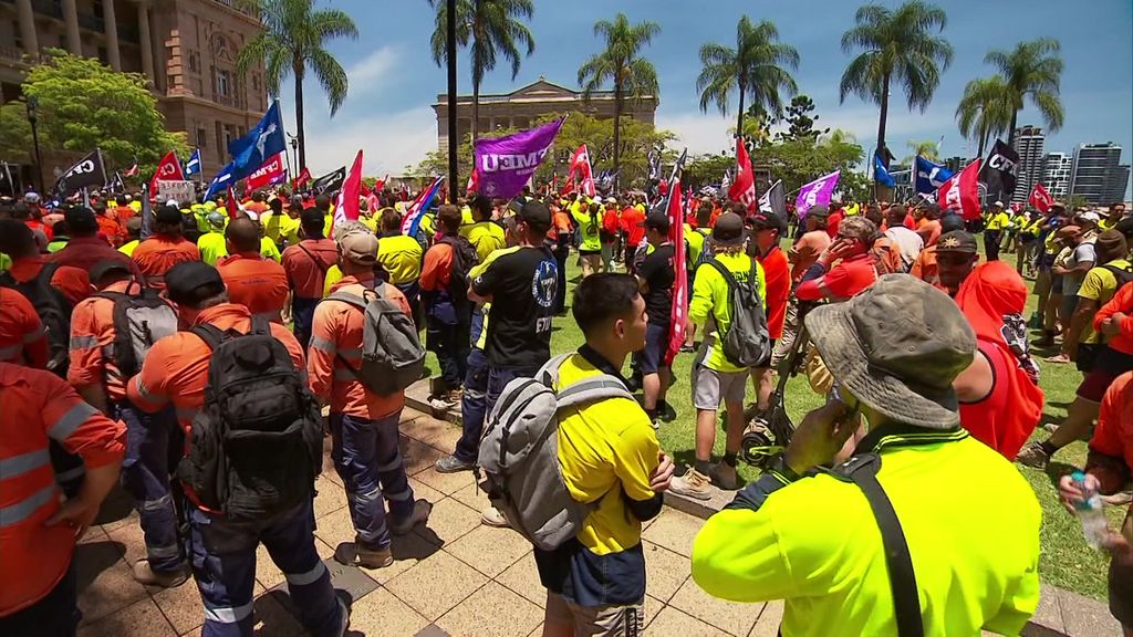 The crowd of union workers cheer in agreement when the speaker calls ...