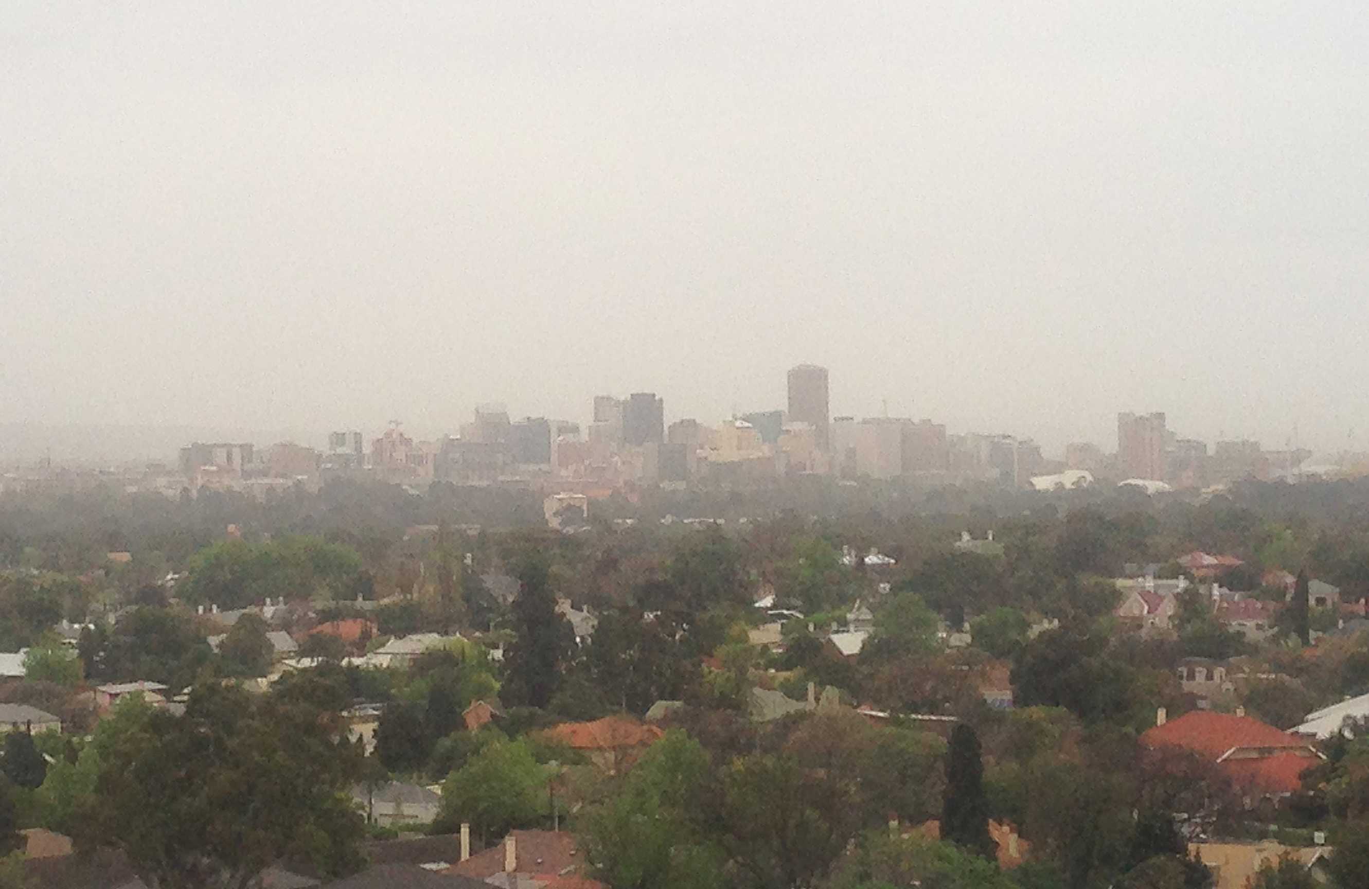 Adelaide disappears into dust, in unseasonal SA heat - ABC News